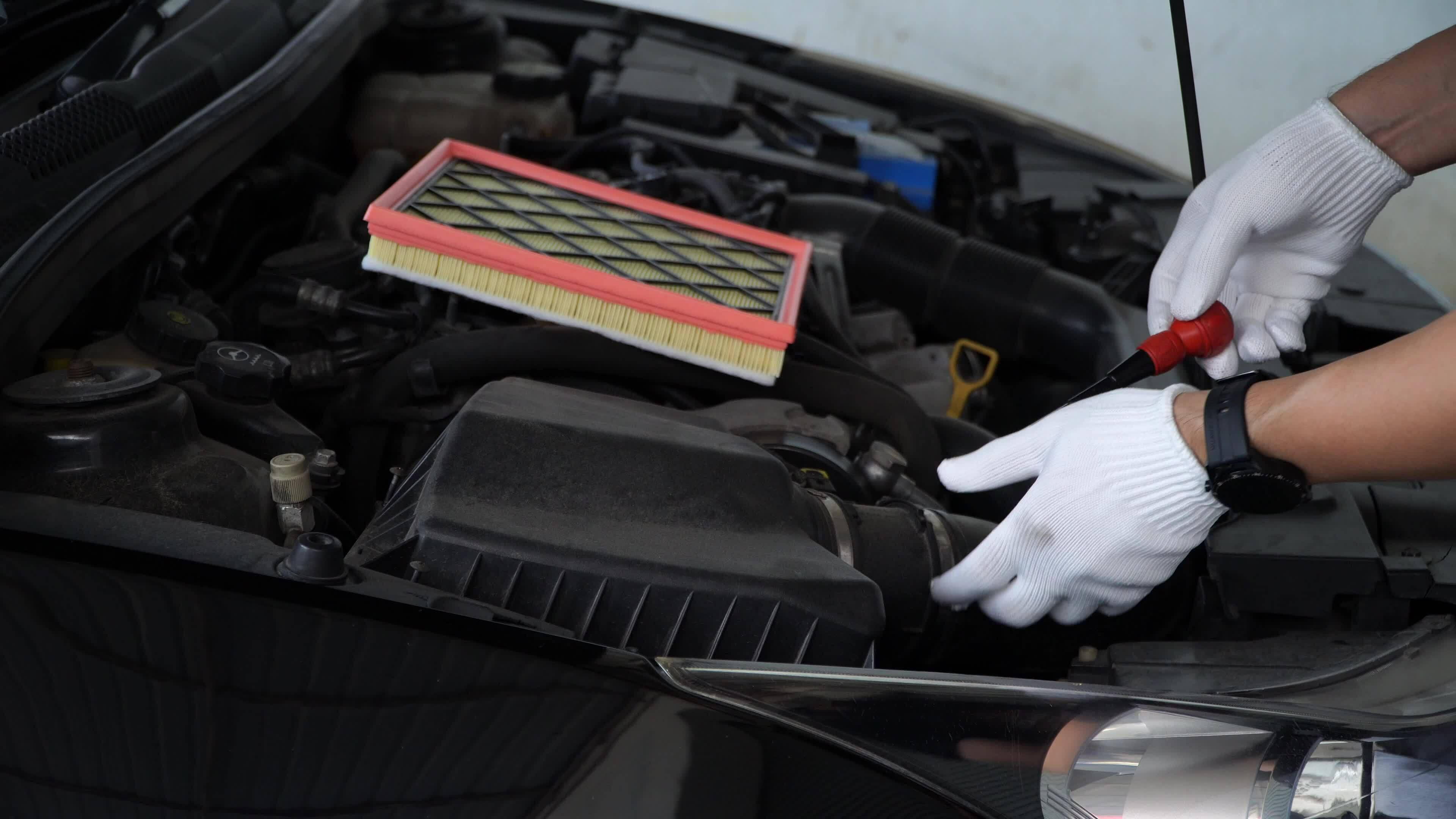 new car air filter in auto maintenance garage.Changing car air filter,Car maintenance concept ...