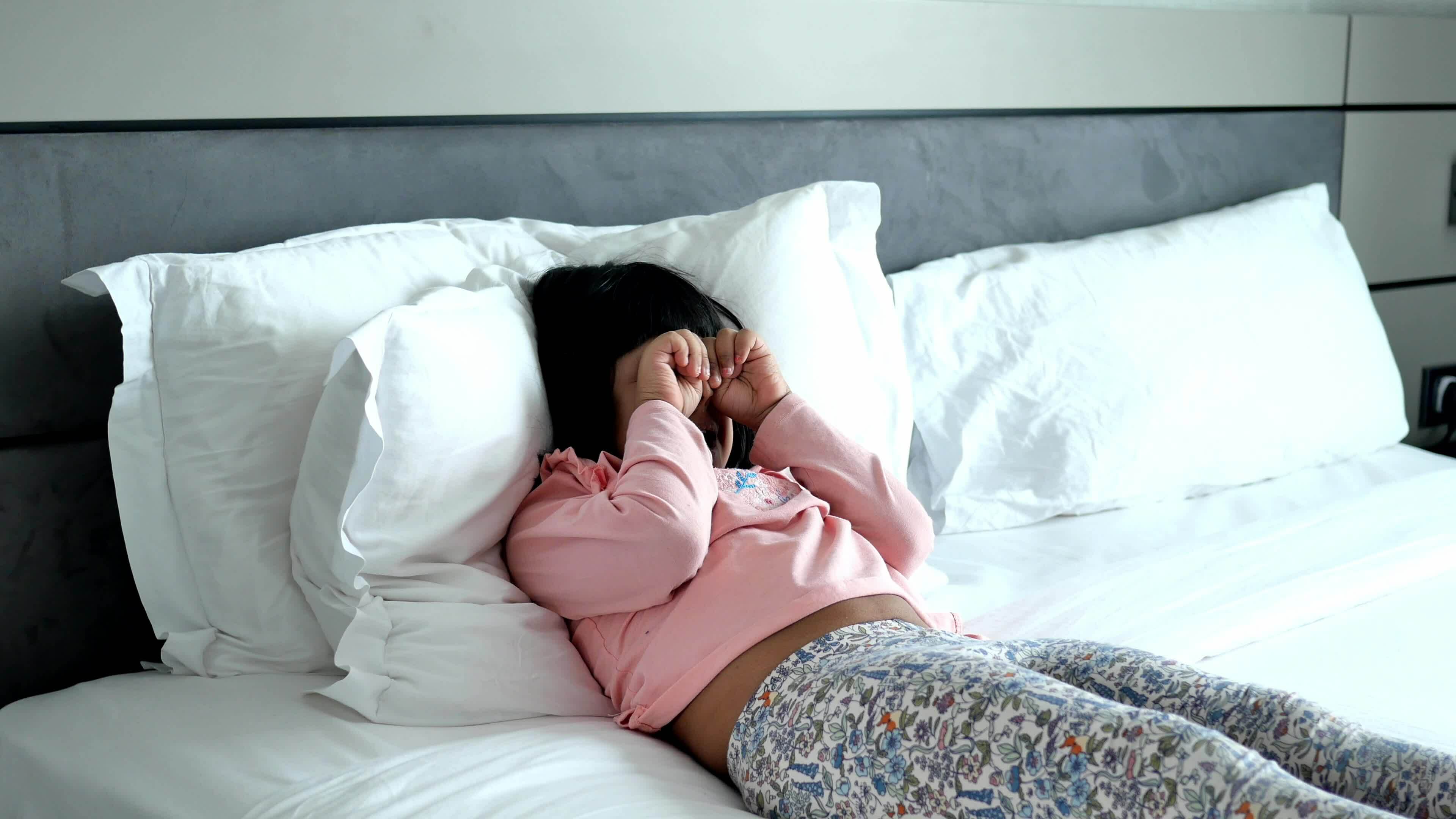 a upset child girl cover her face with hand 35139594 Stock Video at Vecteezy