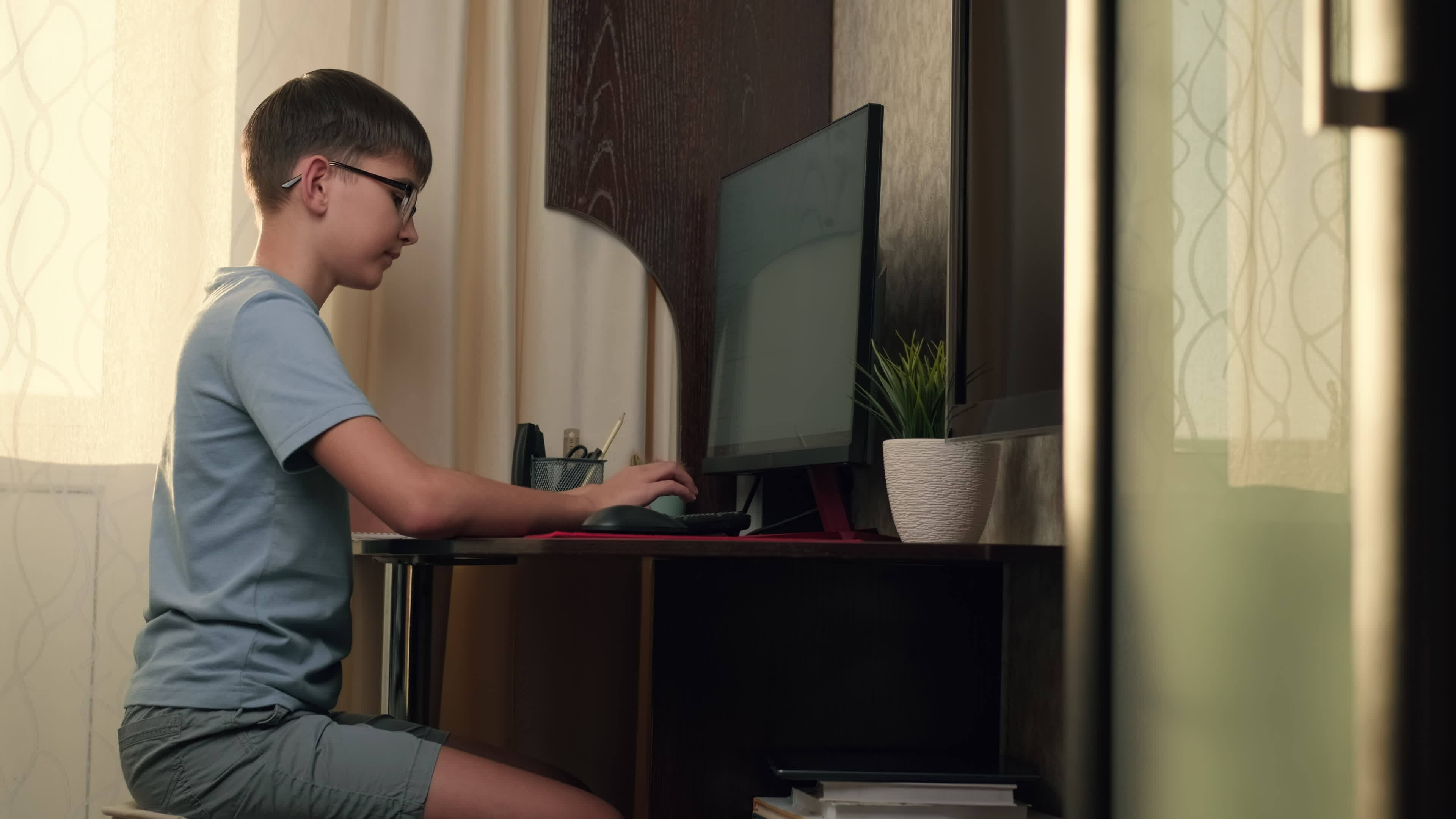 Boy writes program code at home using computer 35288229 Stock Video at ...