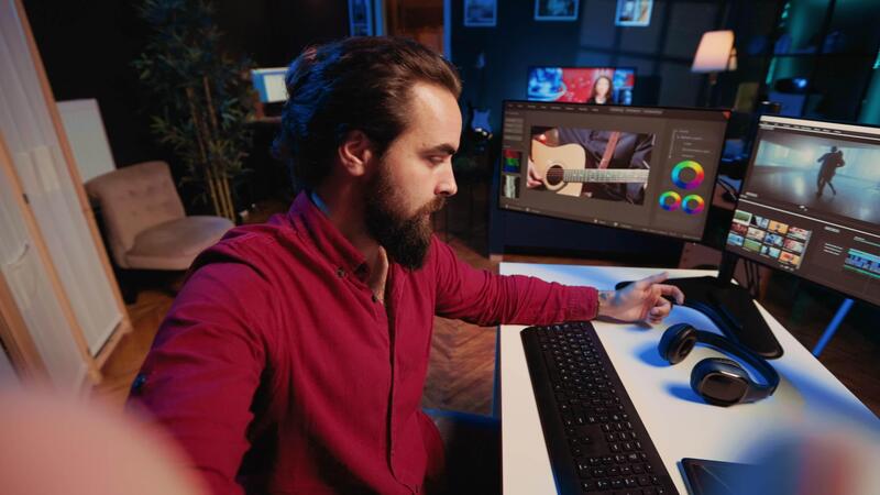 Videographer using selfie camera to record tutorial on how to use software to create visual ...