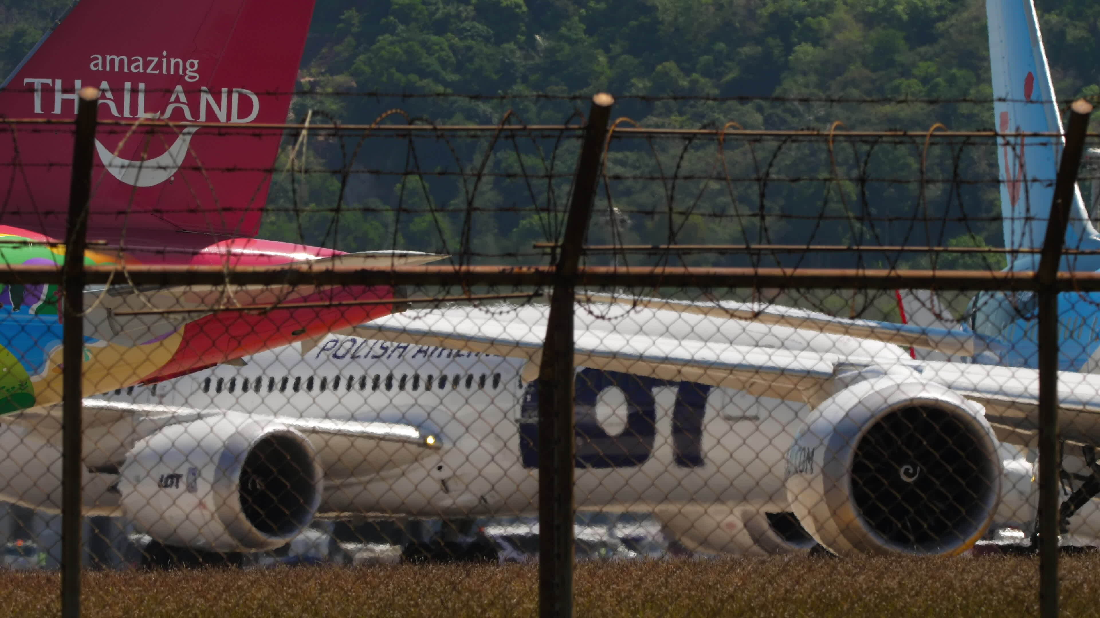 PHUKET, THAILAND - FEBRUARY 10, 2023. Airplanes on the apron, taxiway. Busy aviation traffic ...