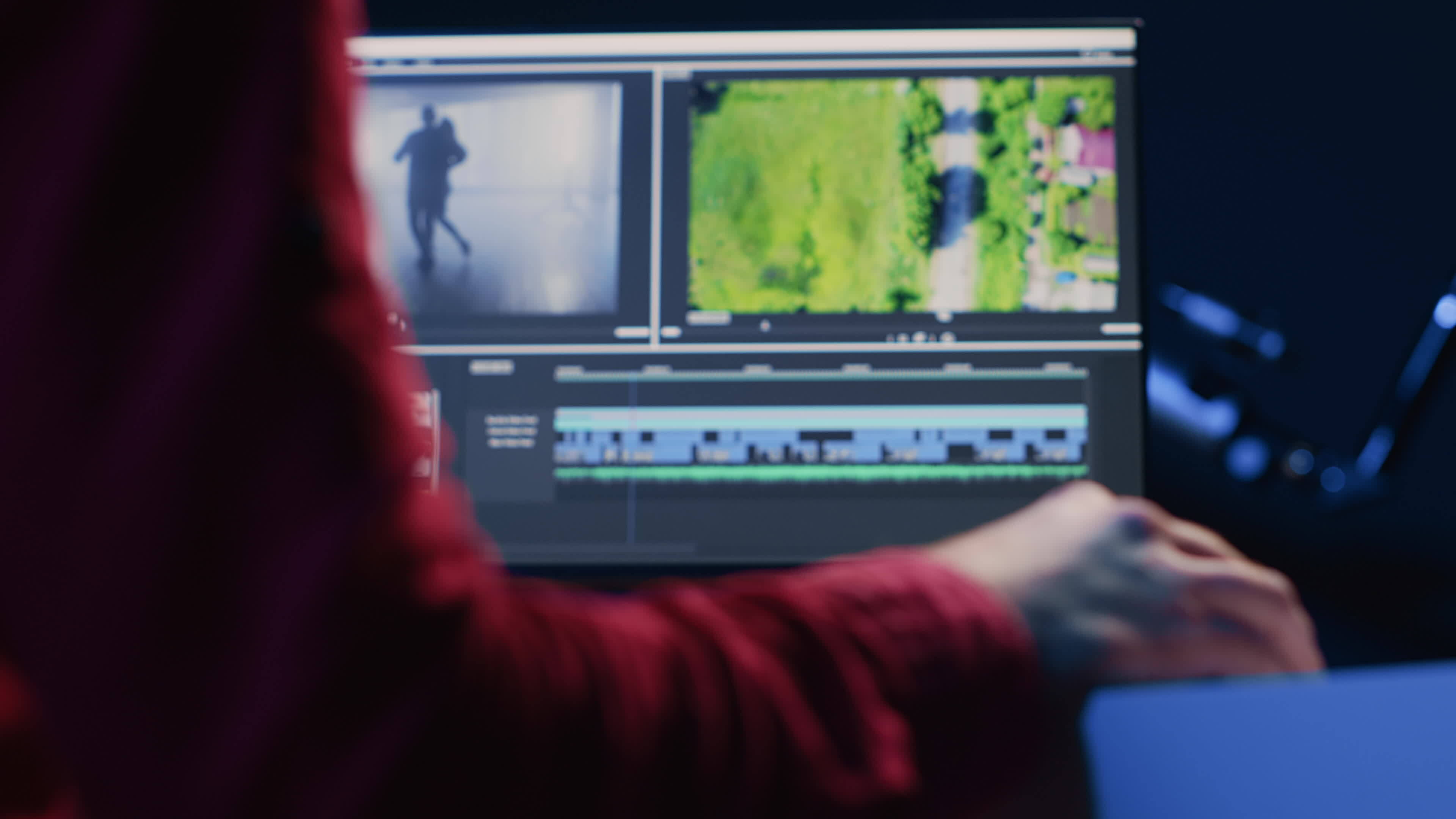 Professional video editor editing color grading and lighting in creative office, analyzing film ...