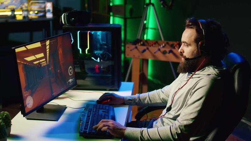Man Upset After Losing While Playing Fps Videogame Using Headphones