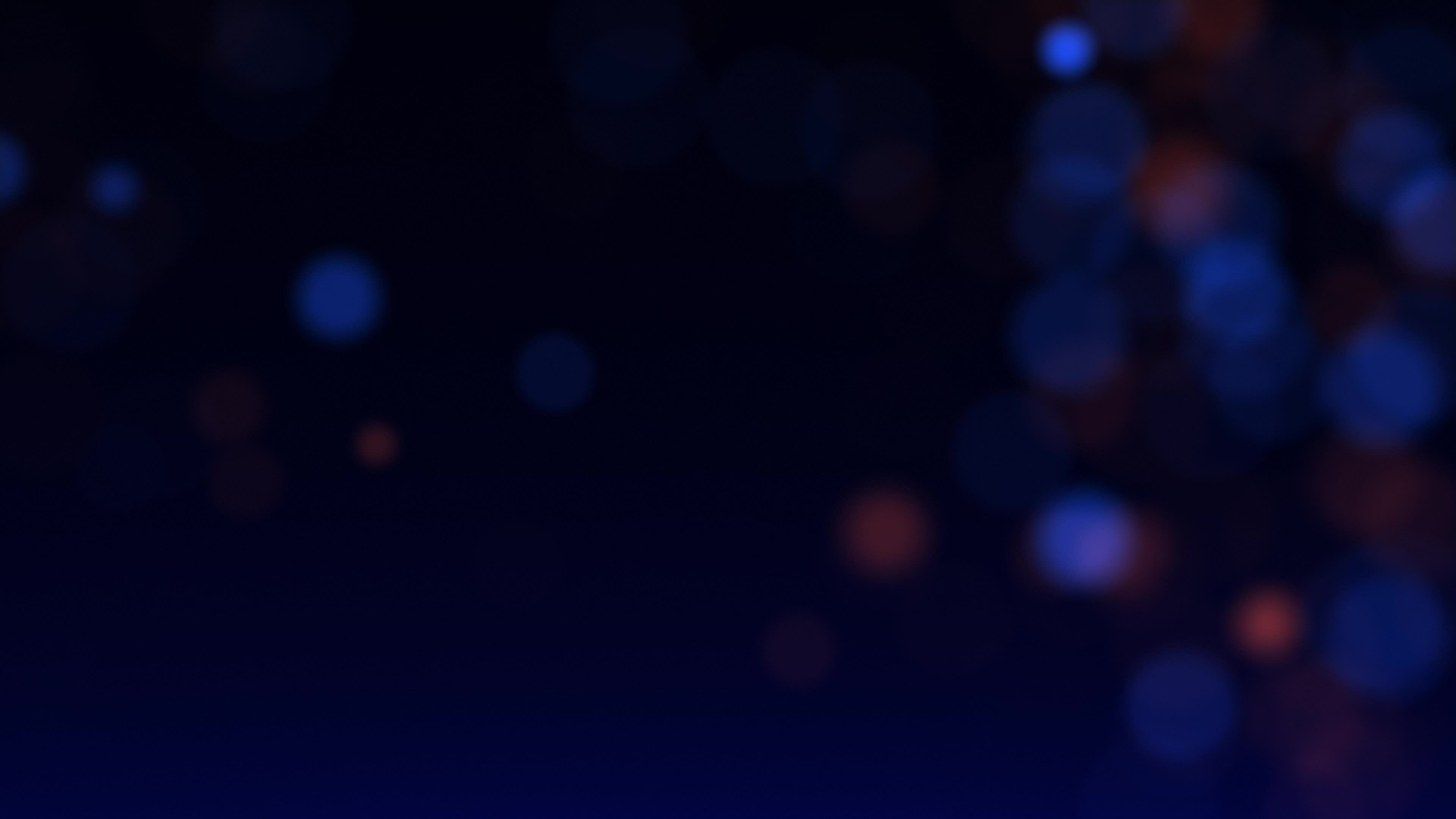 4k Abstract bokeh background loop with light particles on a dark background. animation footage ...