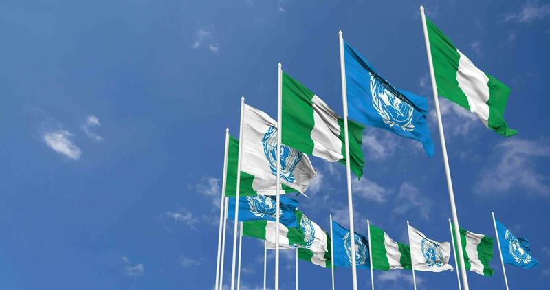 Nigeria and United Nations, UN Flags Waving Together in the Sky, Seamless Loop in Wind, Space on ...