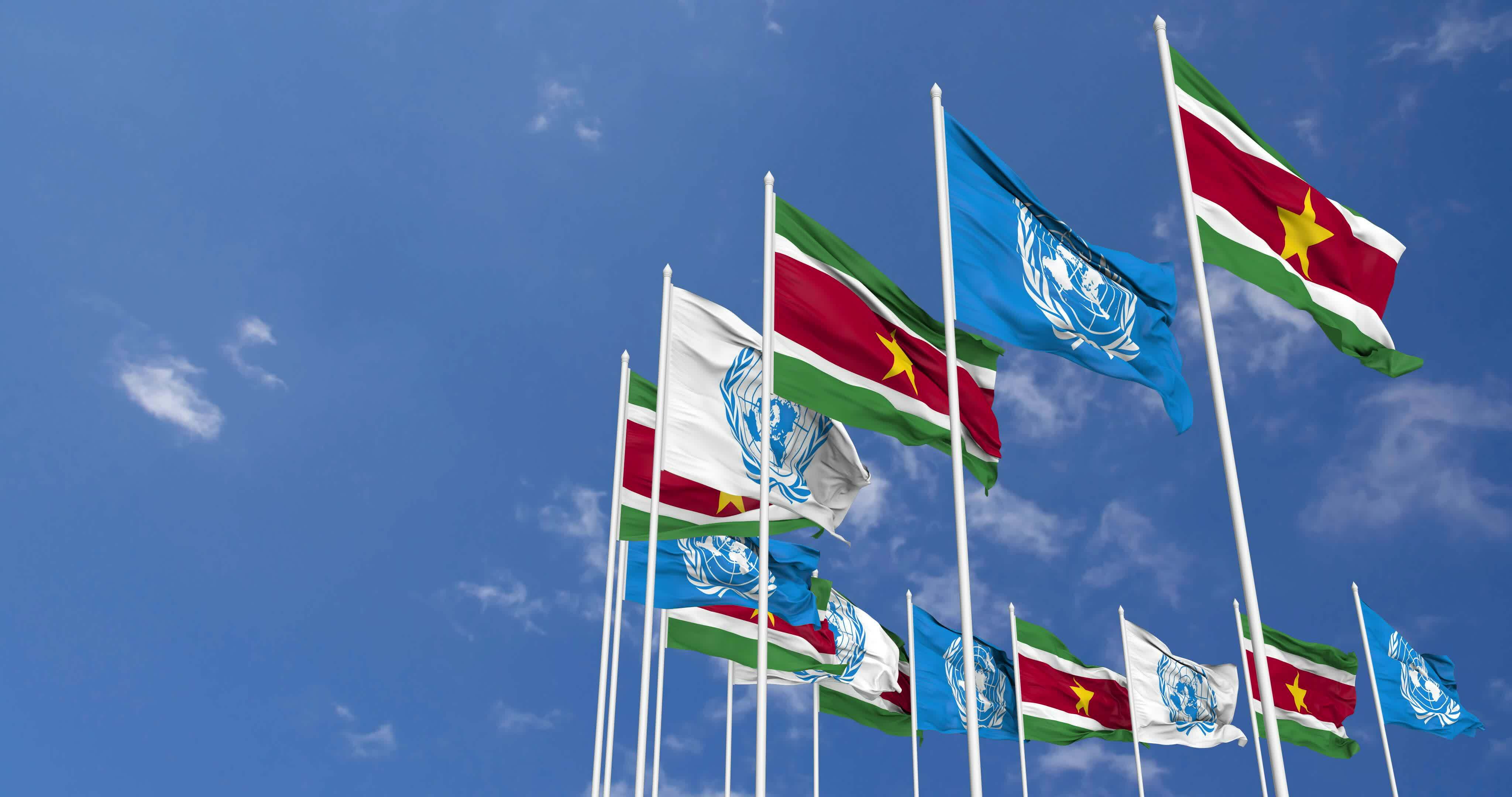 Suriname and United Nations, UN Flags Waving Together in the Sky, Seamless Loop in Wind, Space ...