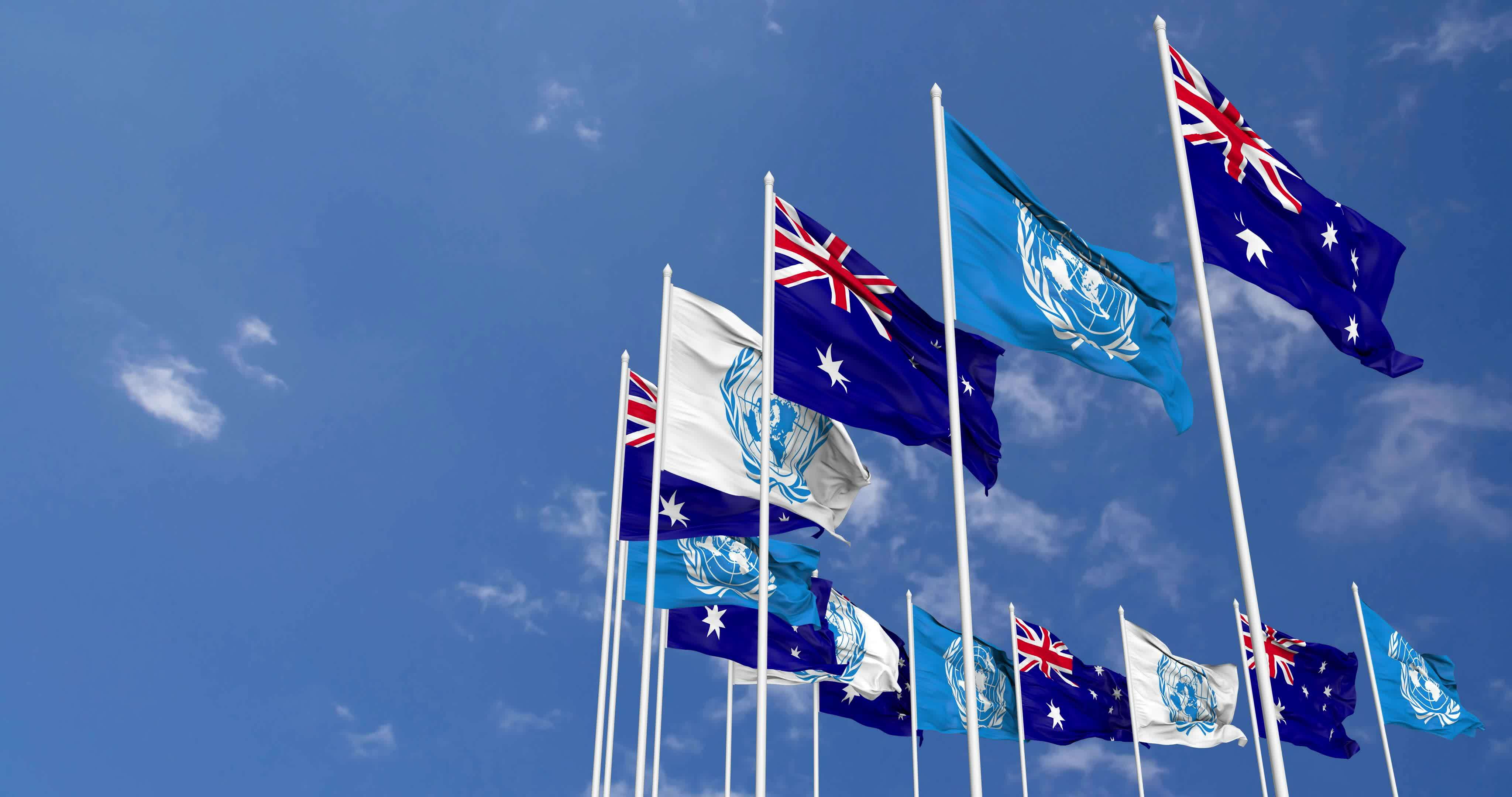 Australia and United Nations, UN Flags Waving Together in the Sky, Seamless Loop in Wind, Space ...