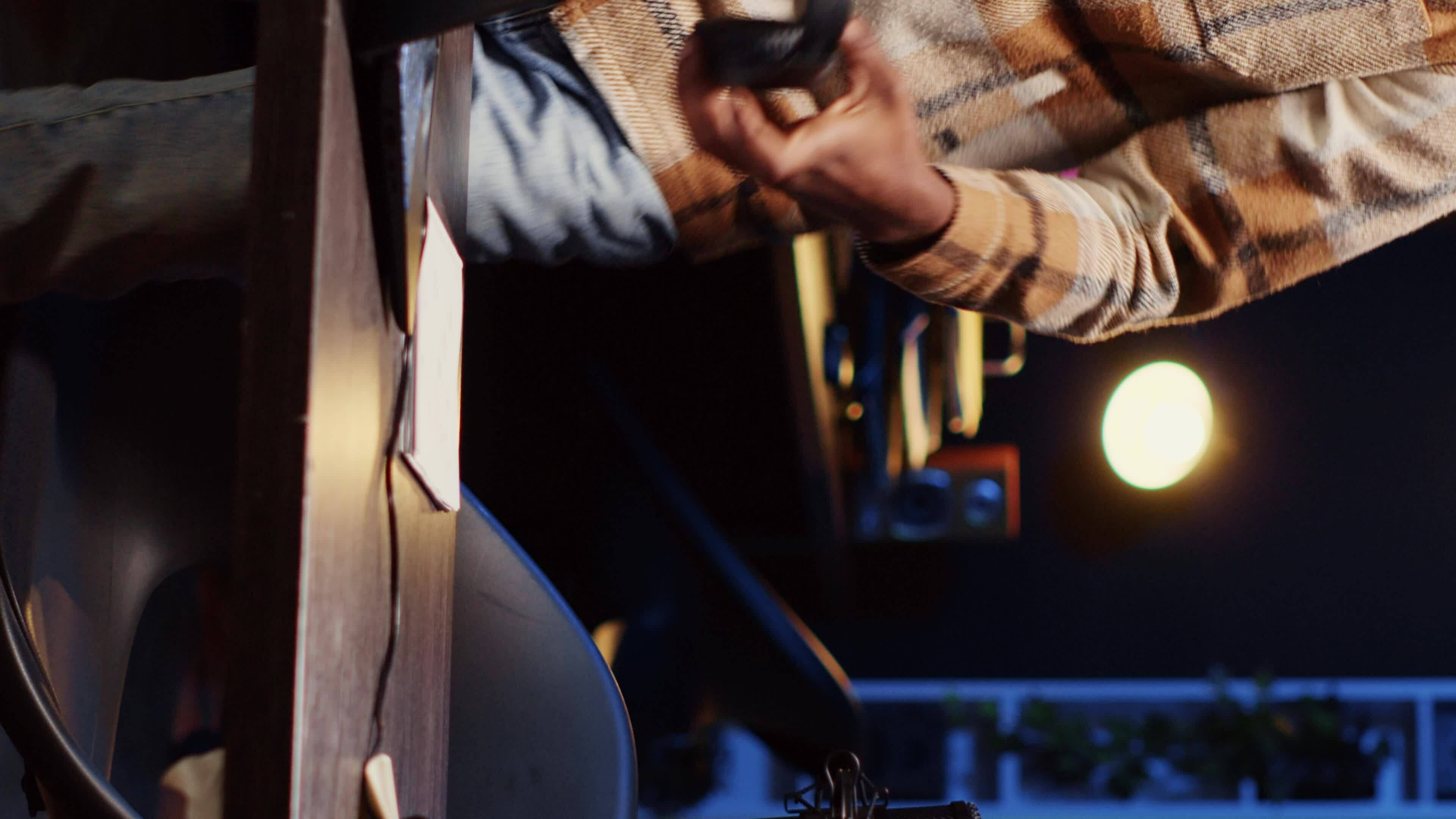 Vertical video Influencer arriving in studio, reading outlined ideas ...