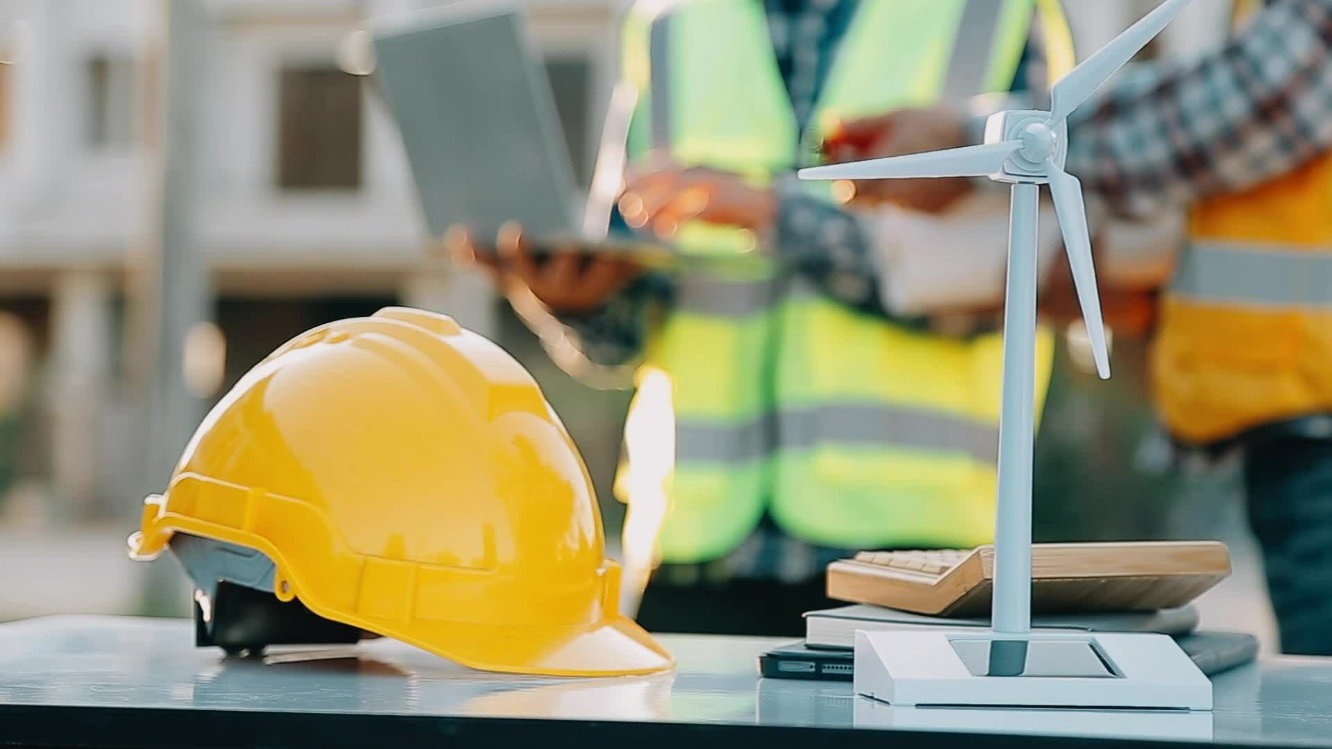 Diverse Team of Specialists Use Laptop Computer on Construction Site ...