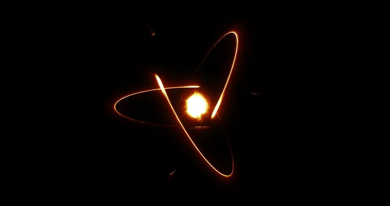 Atom with electrons spinning around the nucleus 36301713 Stock Video at Vecteezy