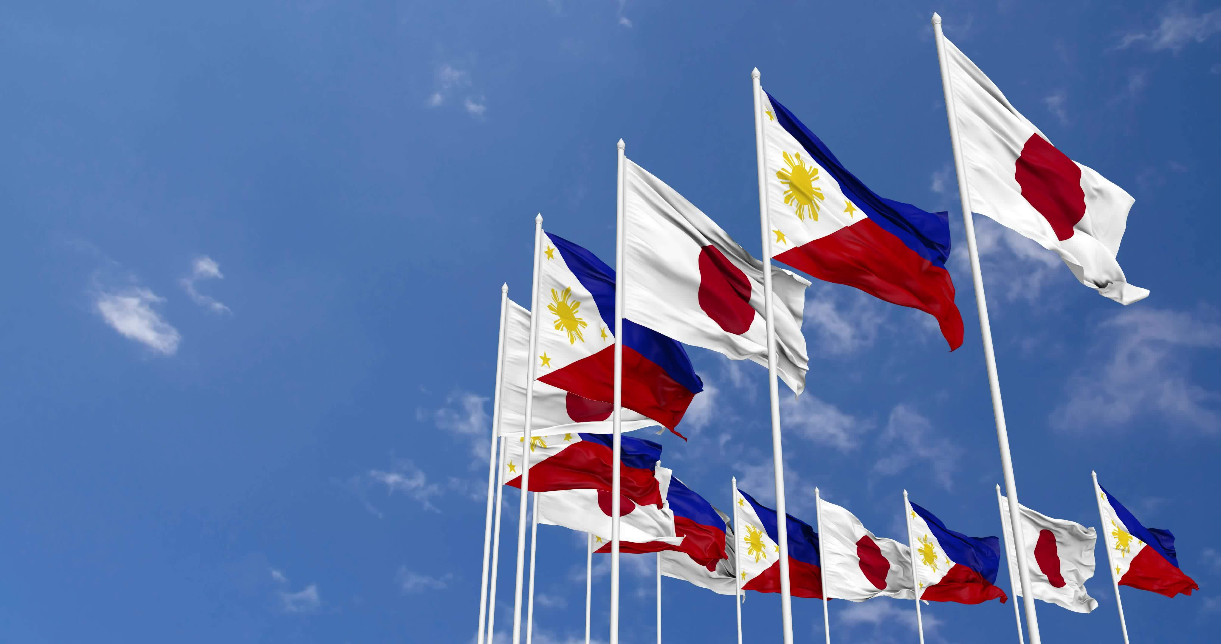 Philippines And Japan Flags Waving Together In The Sky Seamless Loop In Wind Space On Left
