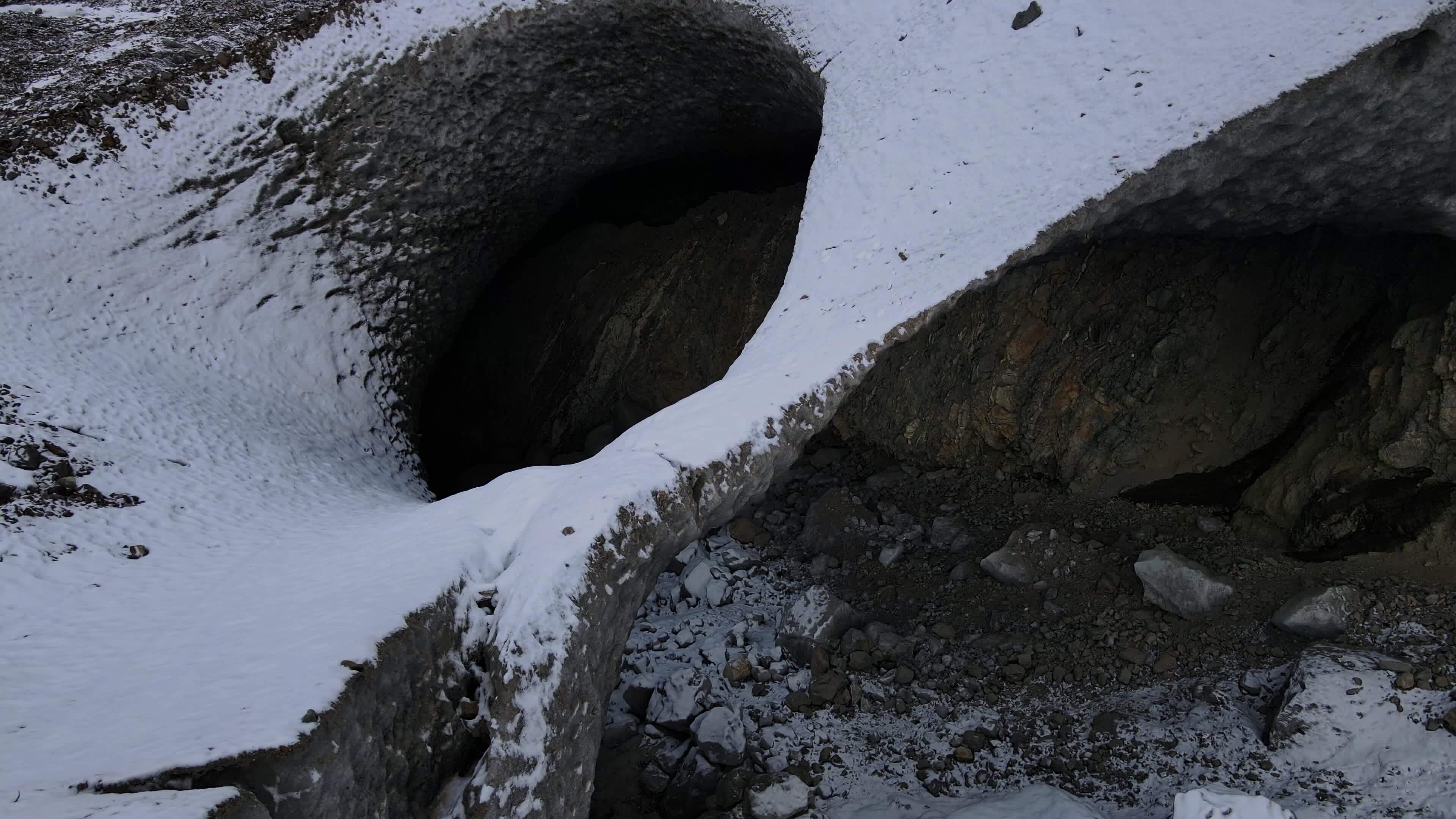 Aerial. An ice arch formed by the melting of a glacier. Ice cave ... Aerial. An ice arch formed by the melting of a glacier. Ice cave ...