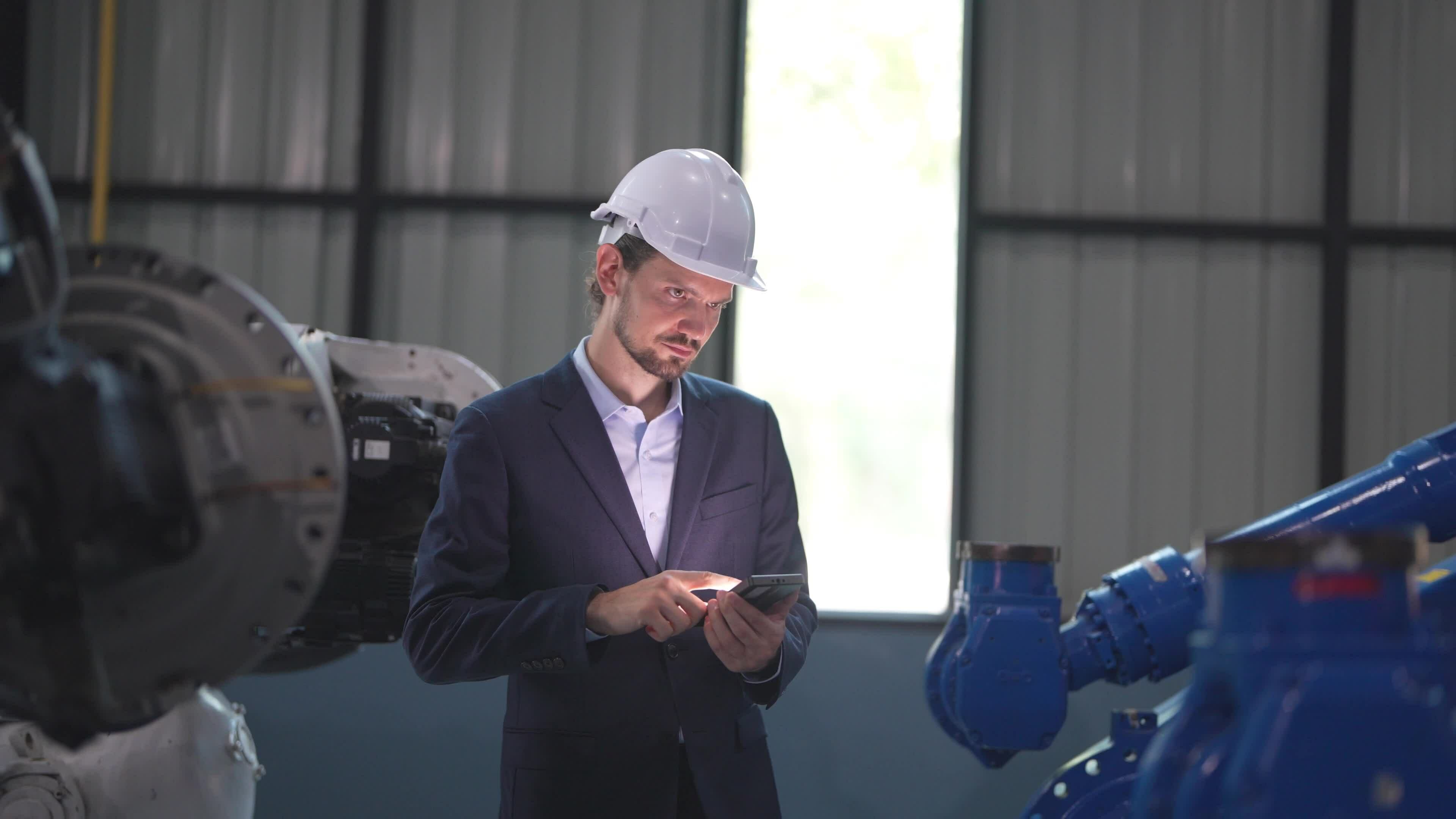 Business engineers meet and check control heavy machine robot arm ...