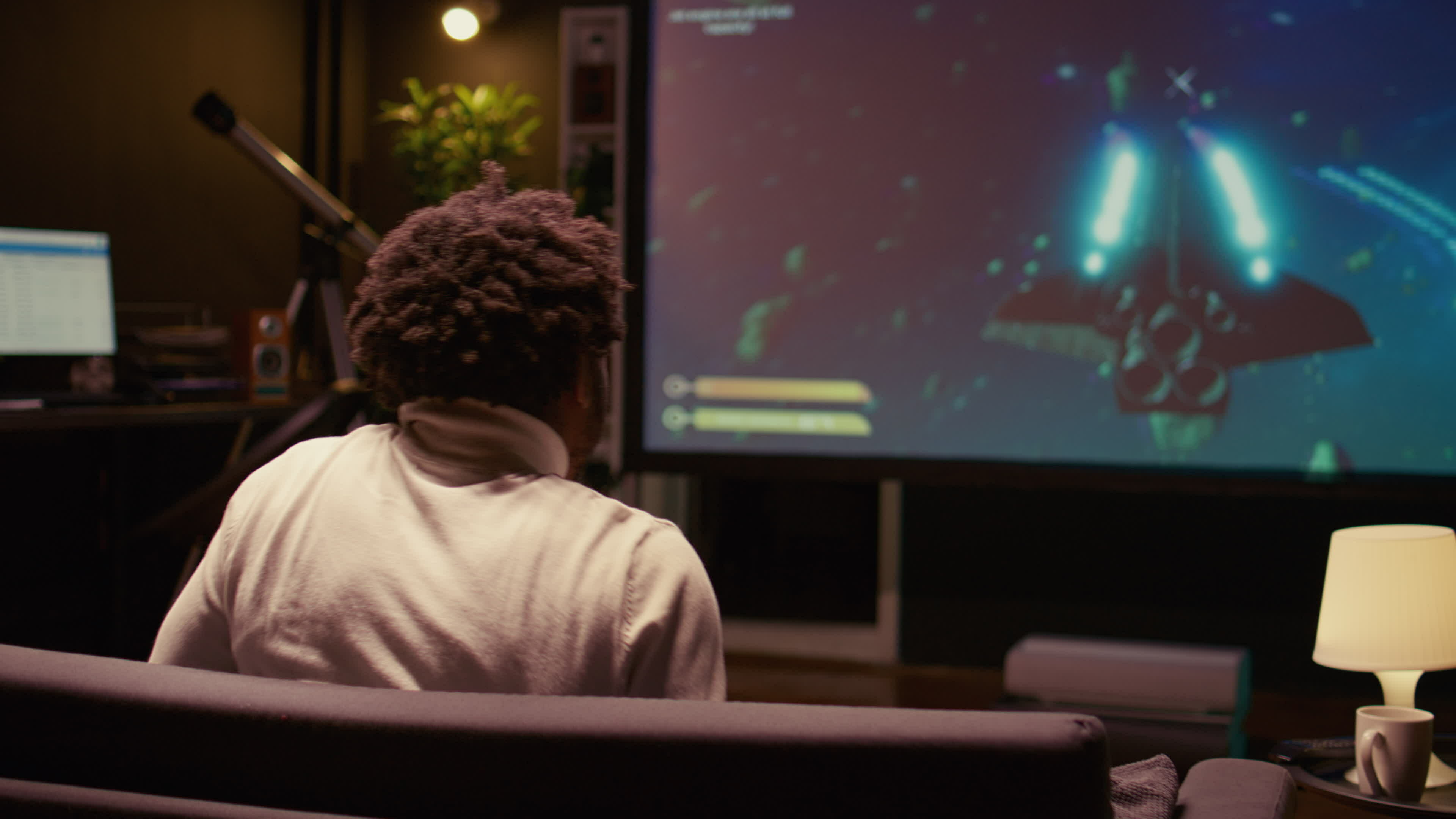 Bipoc Gamer Focused On Defeating Enemies In Classic Arcade Space Shooter Videogame On Ultrawide