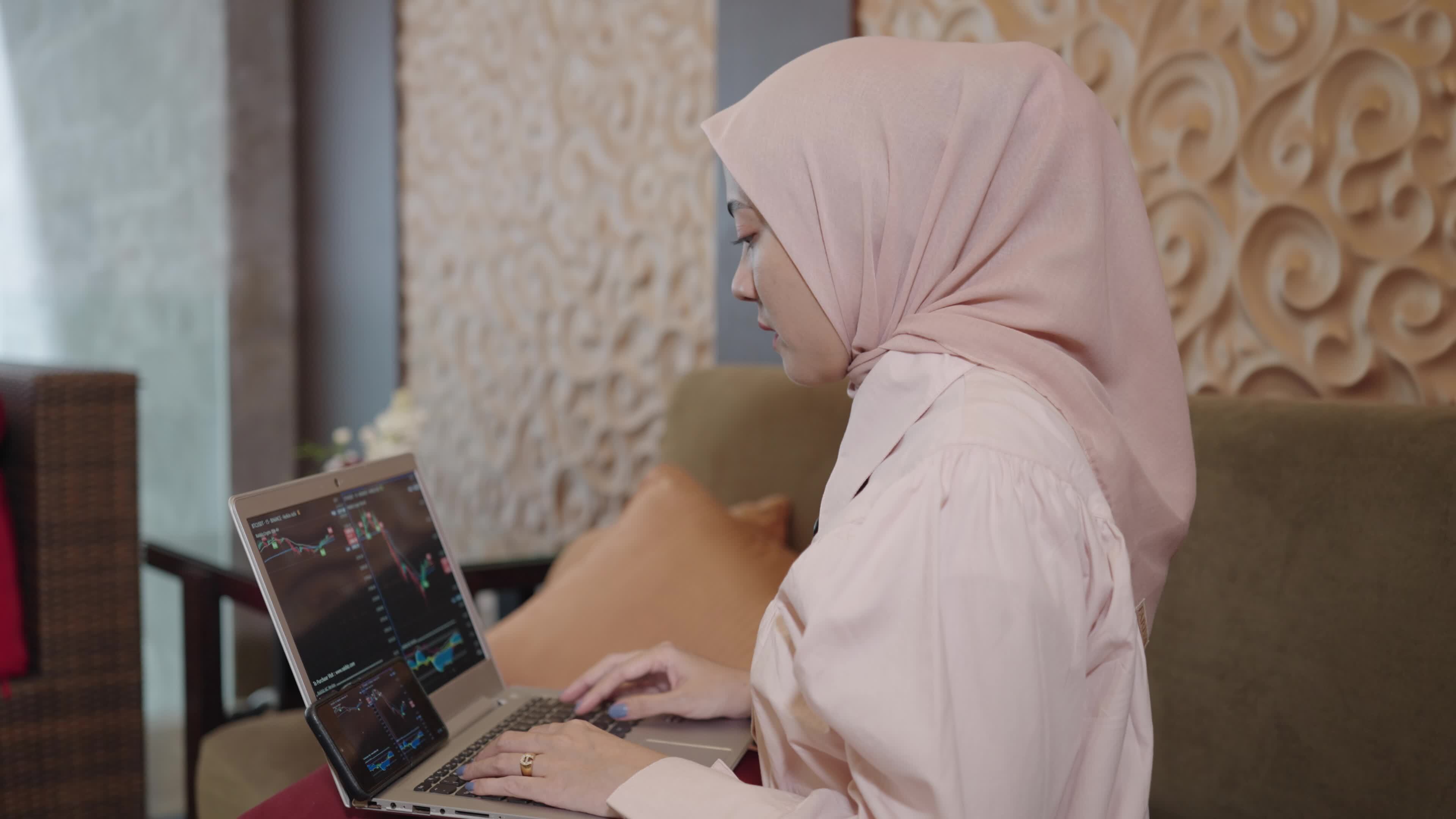 Modern Muslim Woman on Hijab Southeast Asian - Smiling, Looking and Scrolling her Smartphone ...