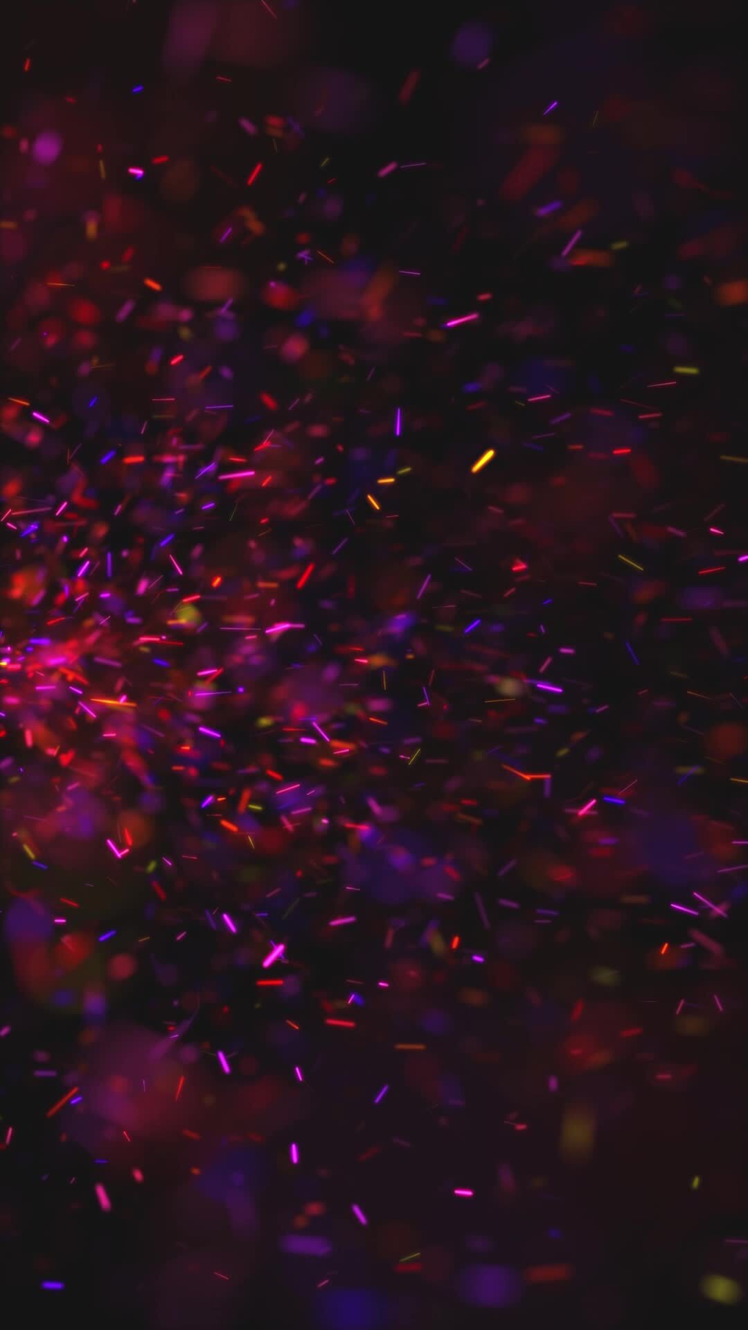 Vertical video - burning multicolored hot sparks and embers fire background animation. Fiery ...