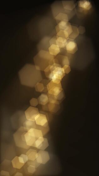 Vertical video - defocused golden bokeh lights background. This elegant motion background ...