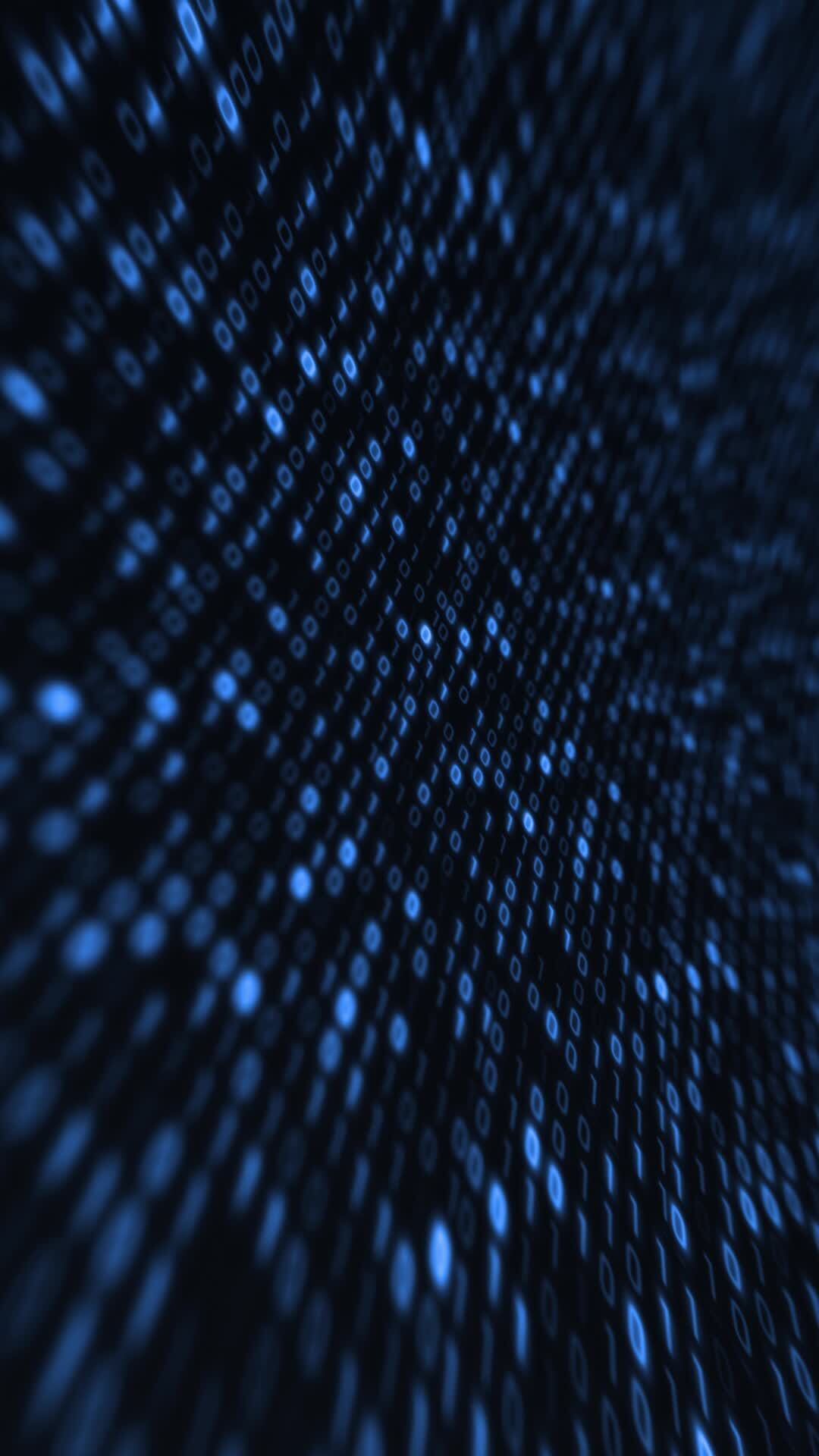 Vertical Video - glowing blue computer binary code ones and zeros moving towards the camera ...