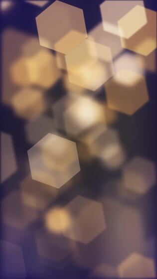 Vertical video - abstract bokeh background animation with gently flickering defocused warm ...