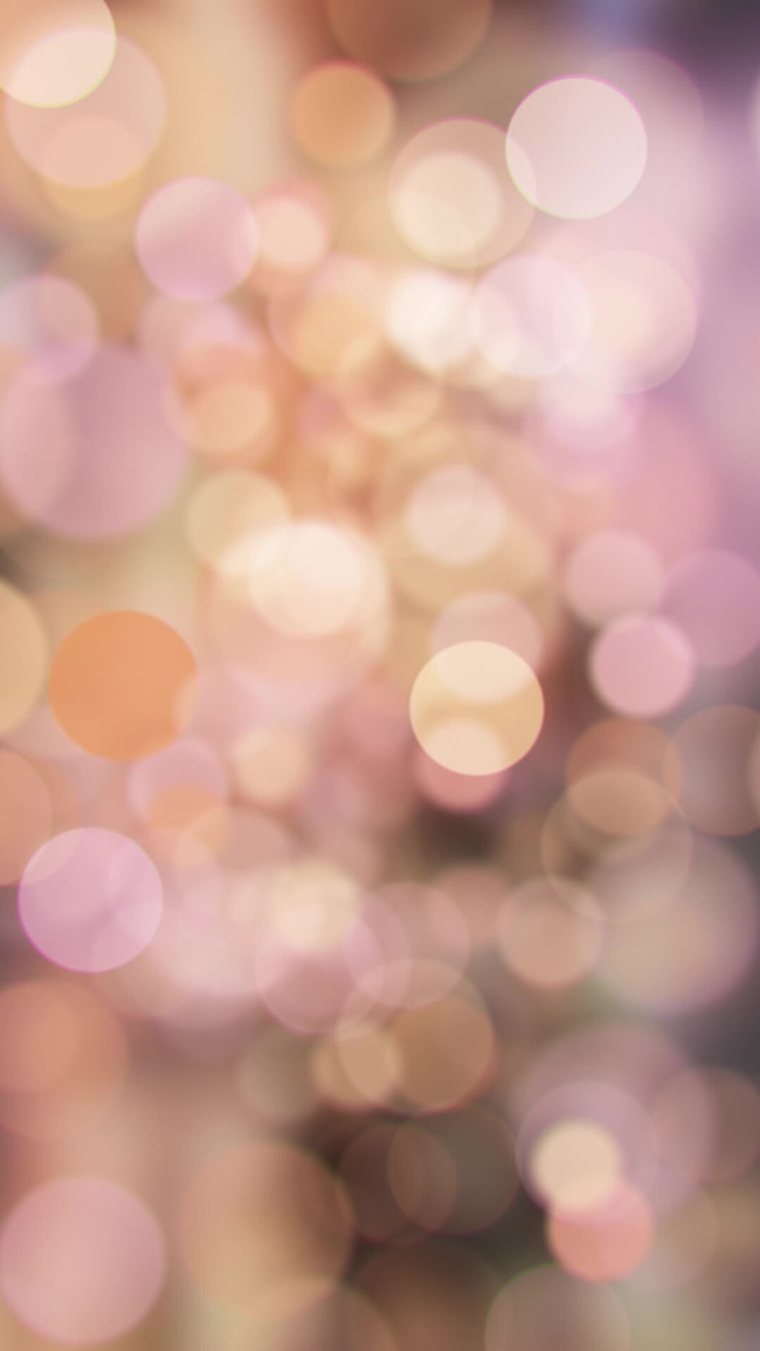 Vertical video - abstract bokeh background animation with gently flickering defocused warm bokeh ...