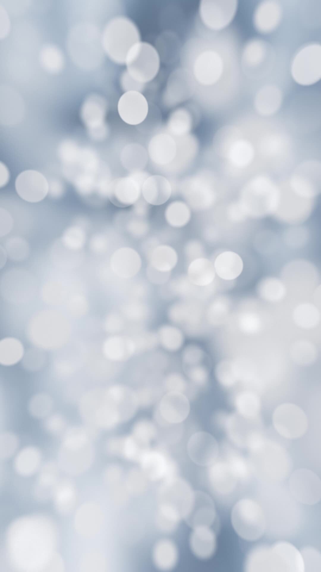 Vertical video - abstract bokeh background animation with gently flickering defocused blue bokeh ...