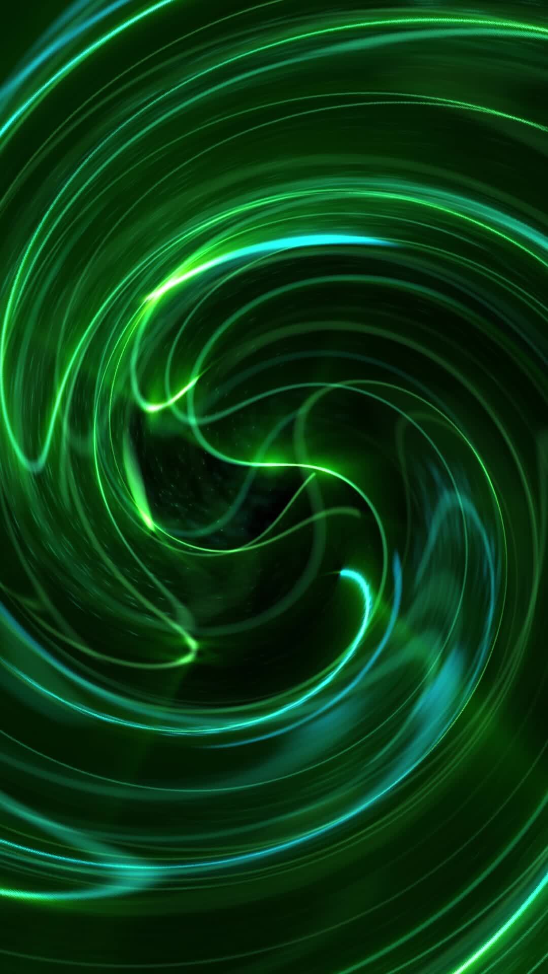 Vertical video - a swirling spiral of green energy light beams and exploding particles. Full HD ...