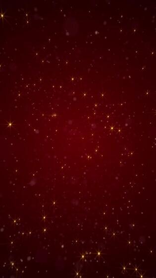 Vertical video - shiny twinkling golden stars and bokeh particles on a dark red gradient. This ...