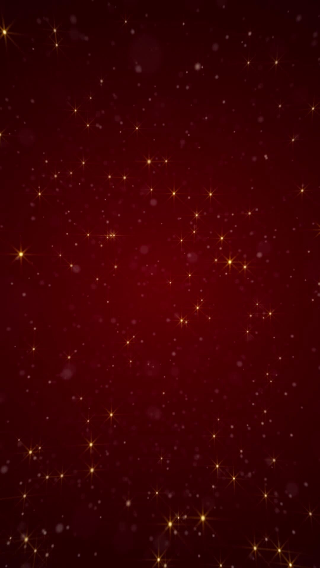 Vertical video - shiny twinkling golden stars and bokeh particles on a dark red gradient. This ...