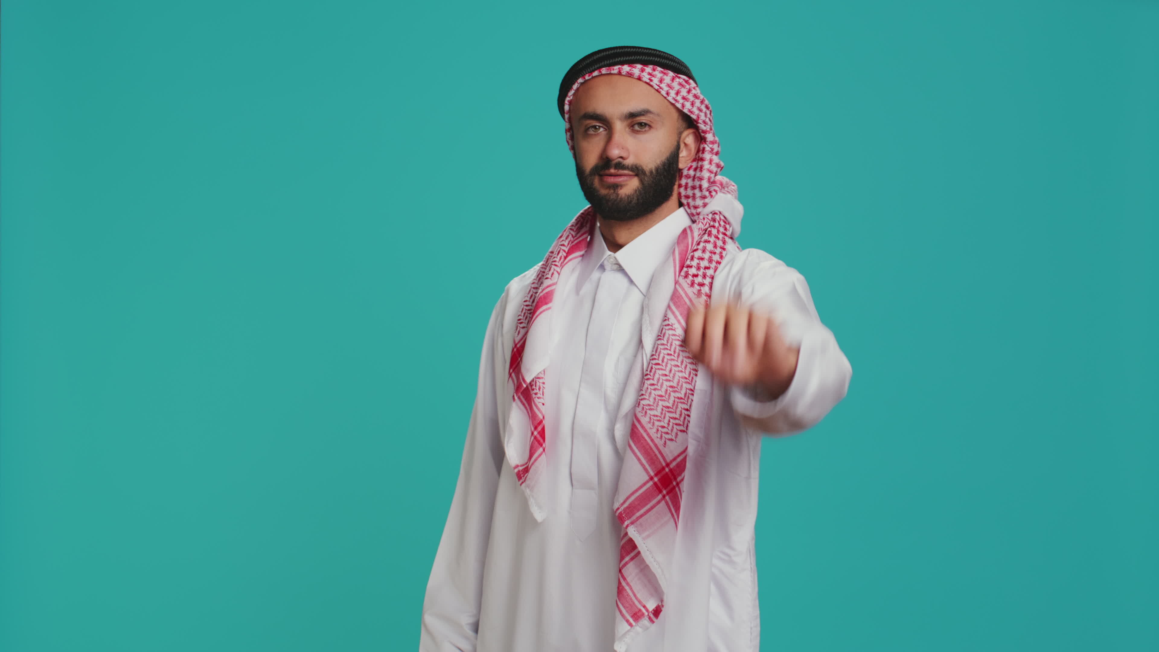 Middle eastern person does stop sign with palm up, expressing refusal ... Middle eastern person does stop sign with palm up, expressing refusal ...