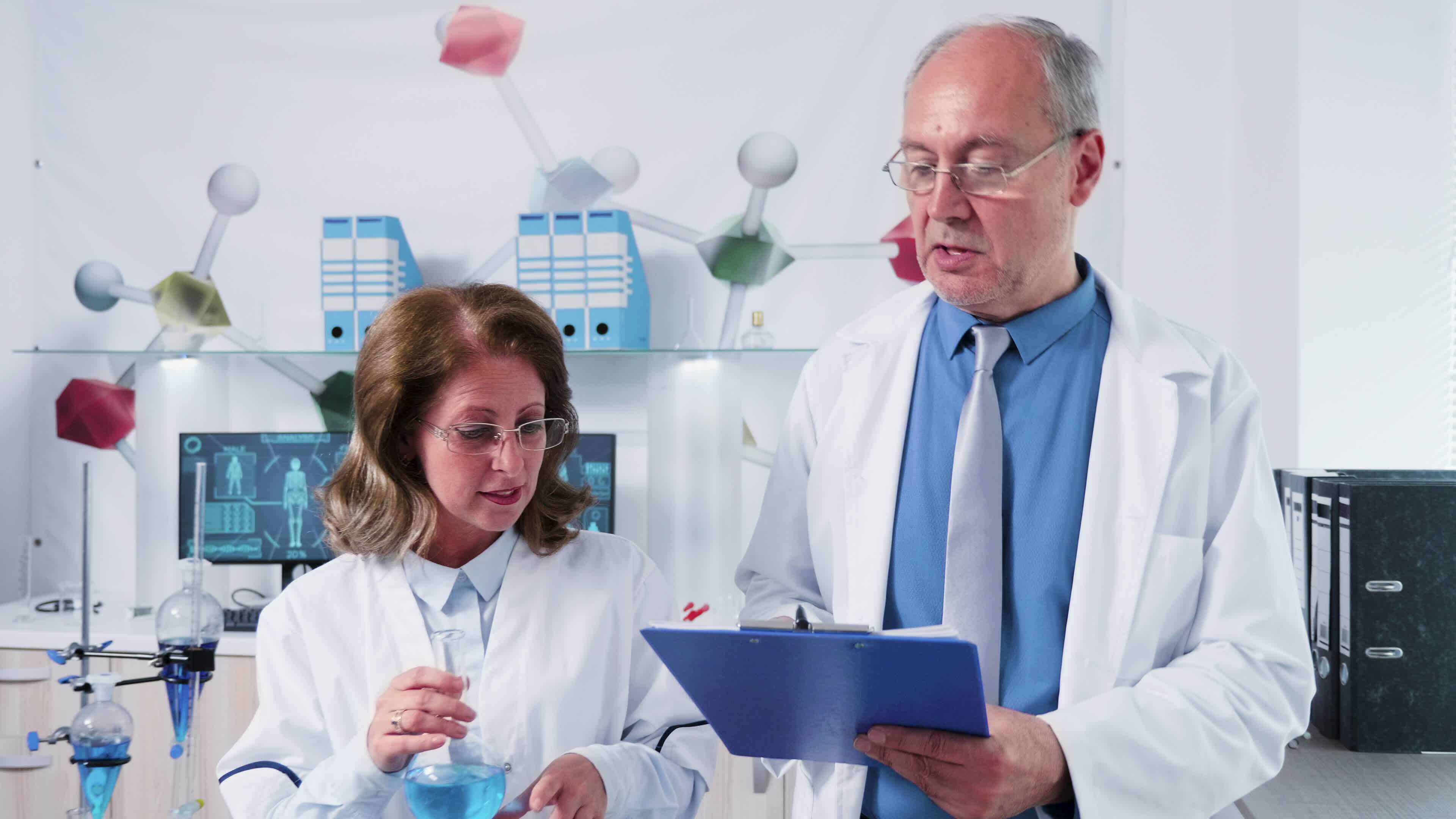 In modern and high end laboratory team of scientists are walking and talking 37766663 Stock ...