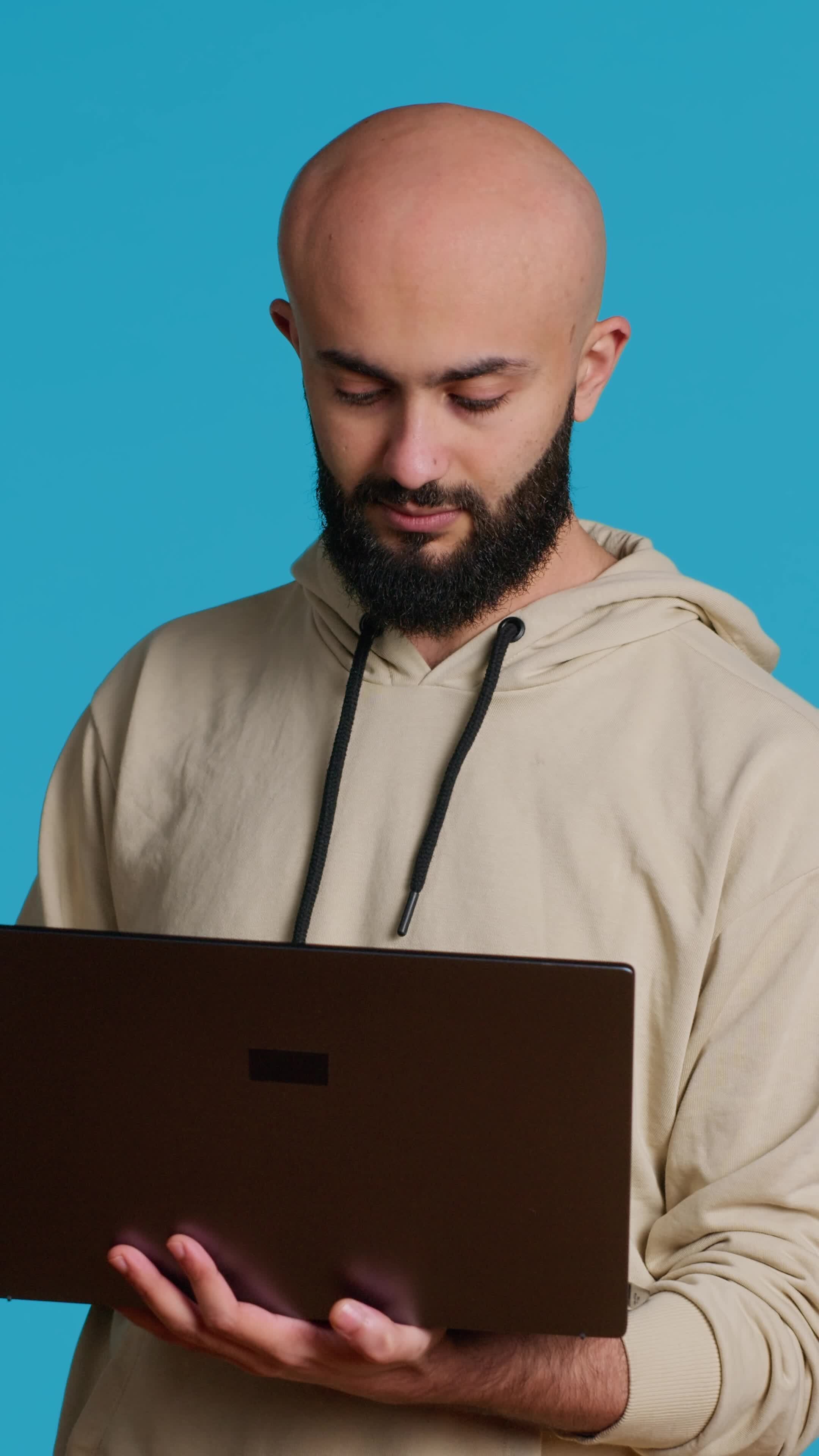 Vertical Video Middle eastern man works with cyber security on laptop ... Vertical Video Middle eastern man works with cyber security on laptop ...