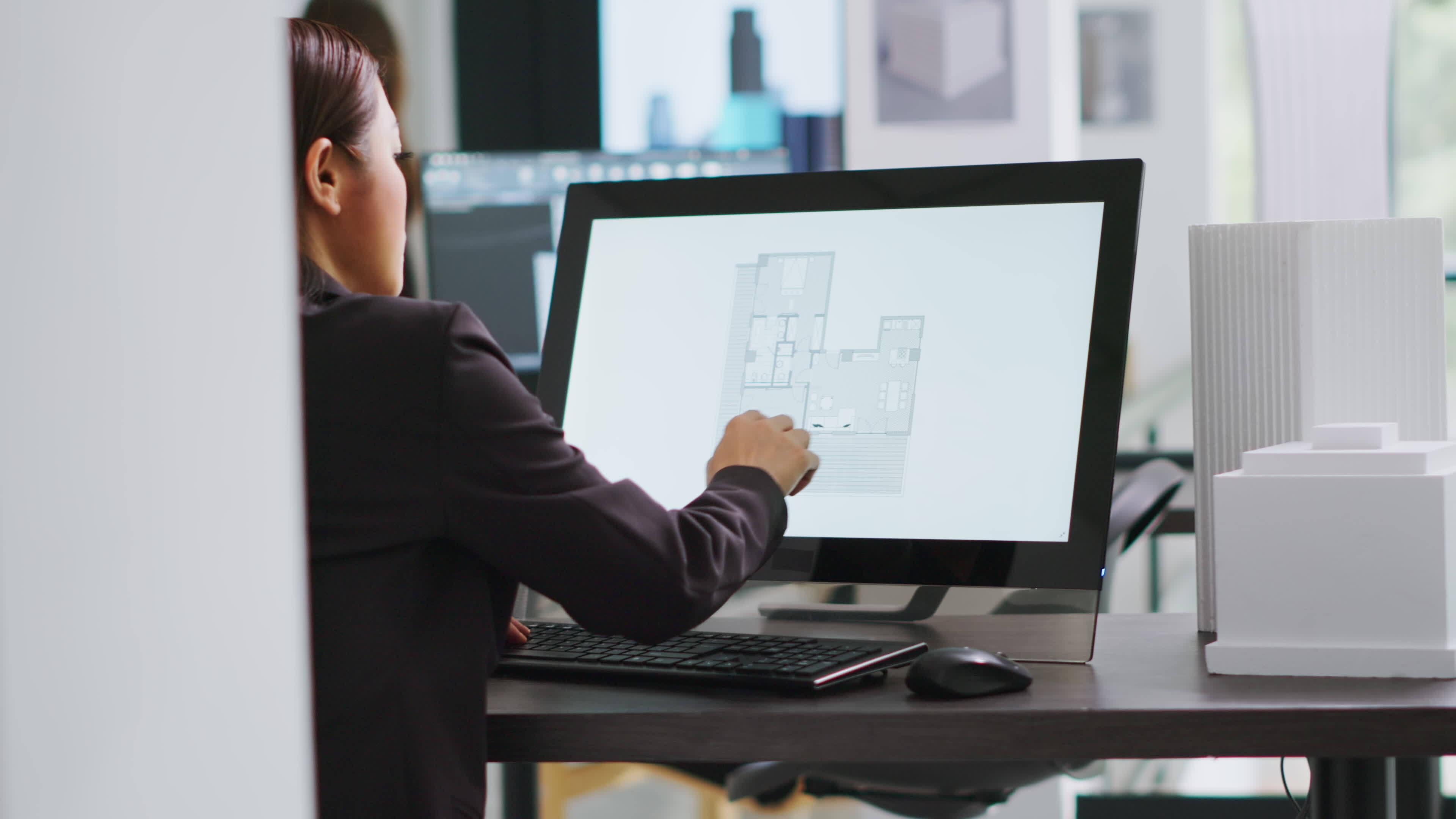 Technician operating on cad software to create blueprint for new architectural scaling project ...