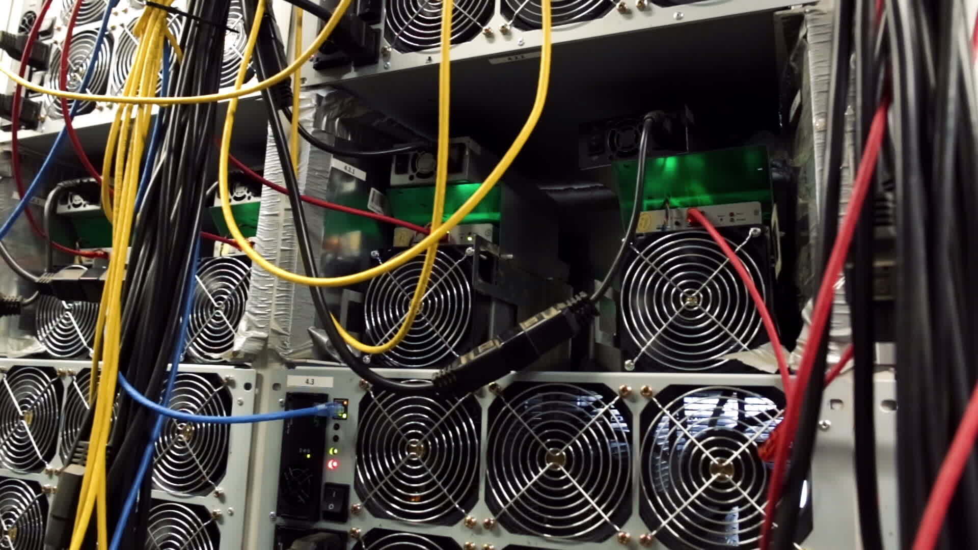 Multicolored data center wiring. Stock footage. Close-up of wall of computer data centers with ...