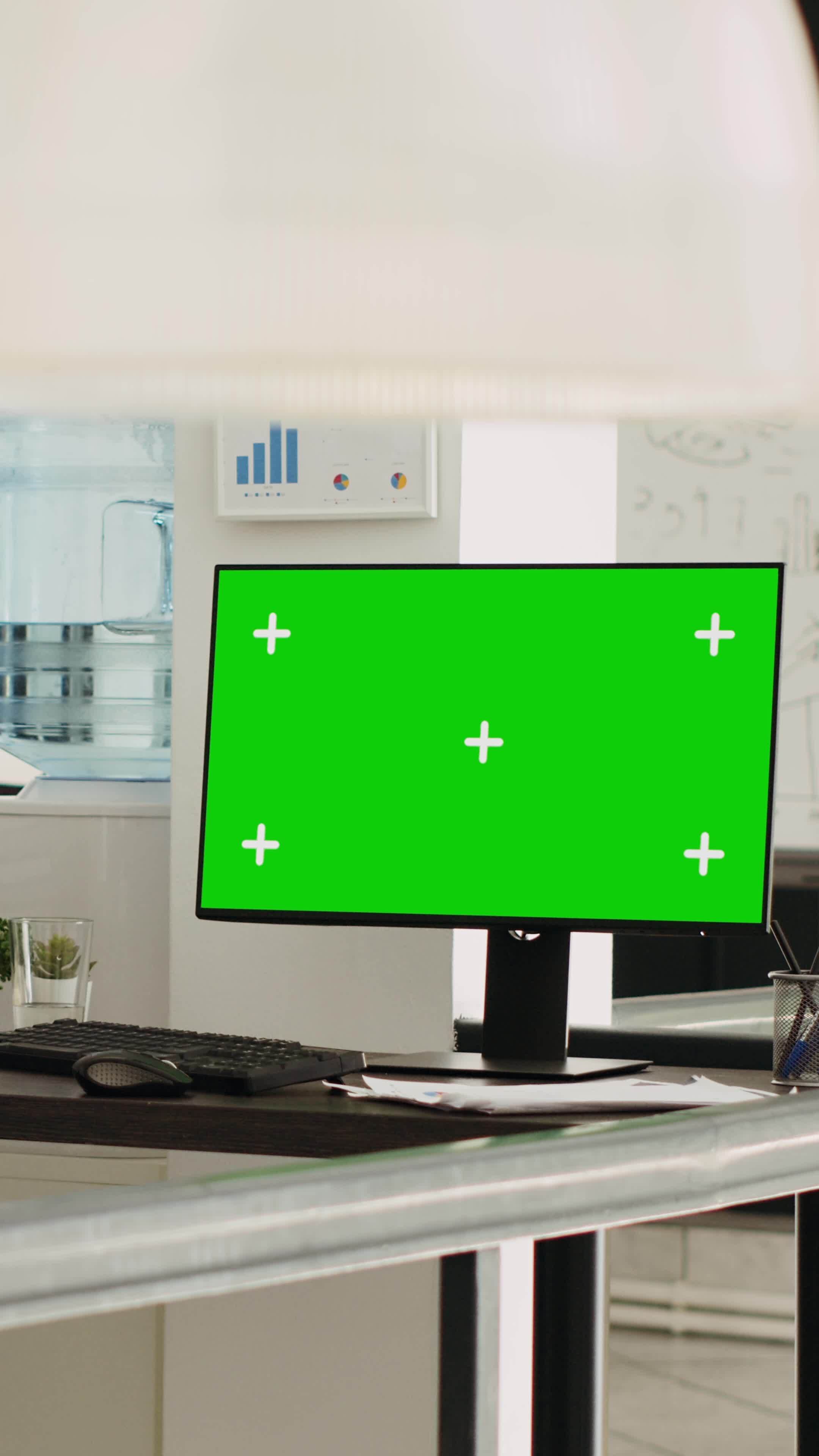Vertical Video Empty Desk With Greenscreen Layout On Computer In Coworking Space With People