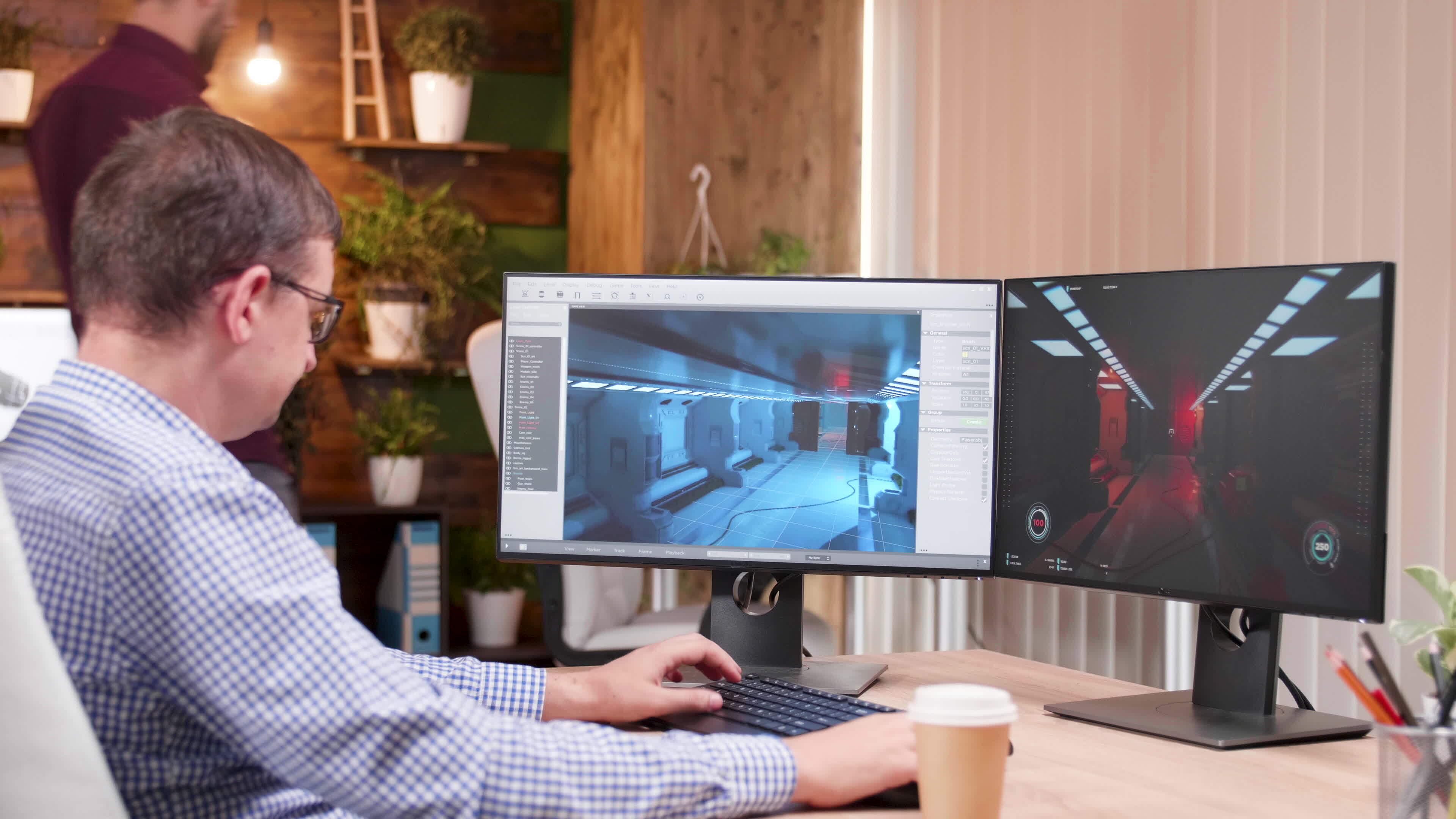 Game designer developing graphics for new game using a modern software ...