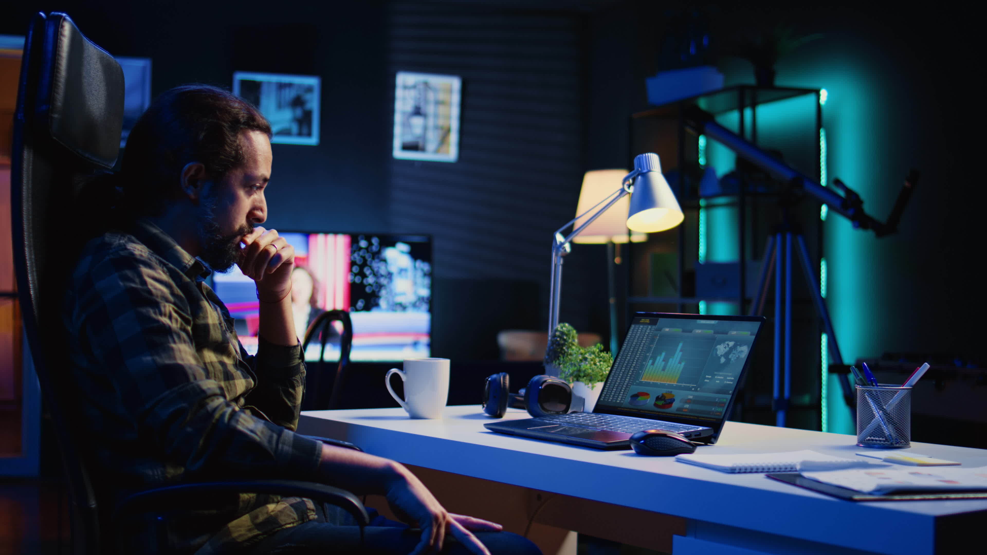 Remotely working company financial advisor analyzing statistical graphs ...