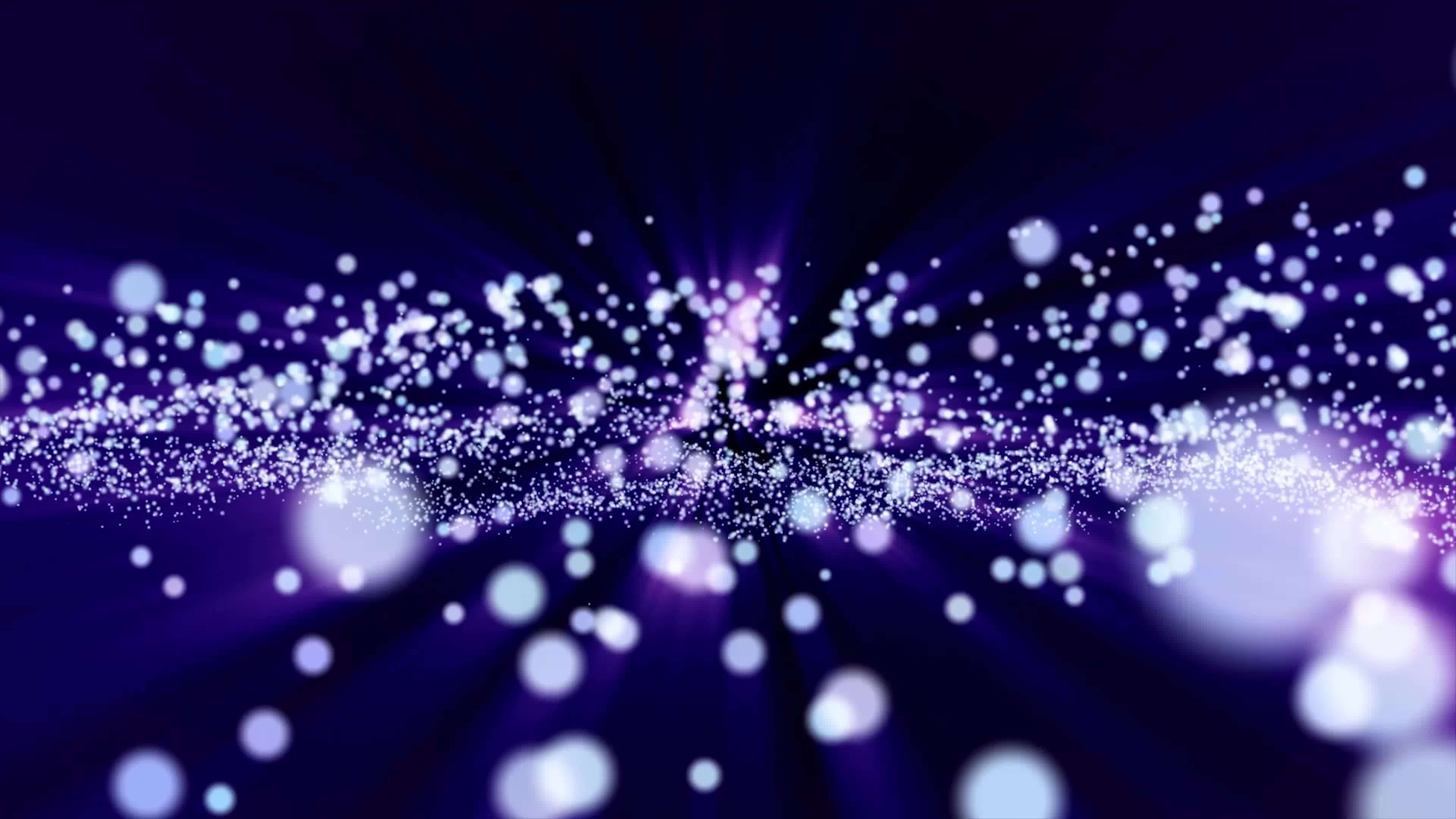 Glittering particles sparkle and drift along. Abstract background with shining bokeh sparkles ...