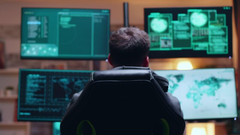 Back view dangerous and wanted cyber criminal searching on government database. 38910017 Stock ...