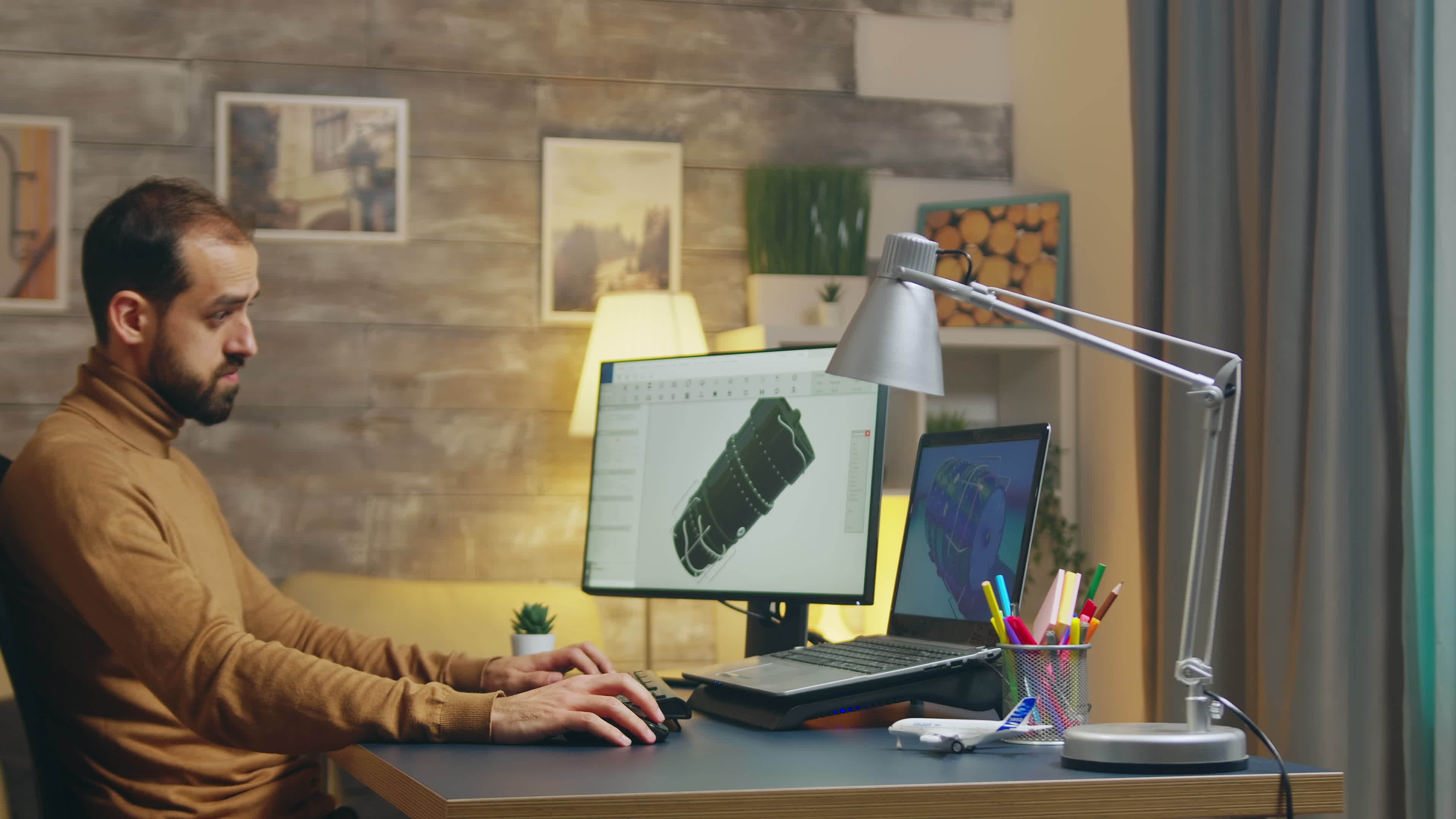 Engineer typing data for turbine design using modern software in home ...