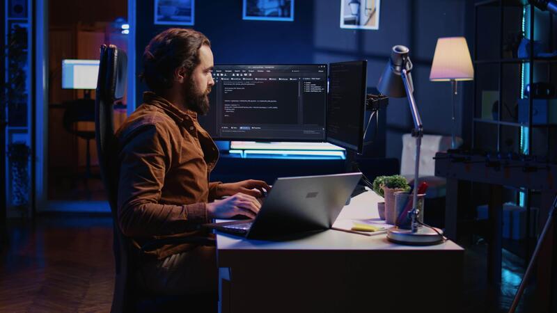 Fatigued software programmer working overnight at home, taking break ...