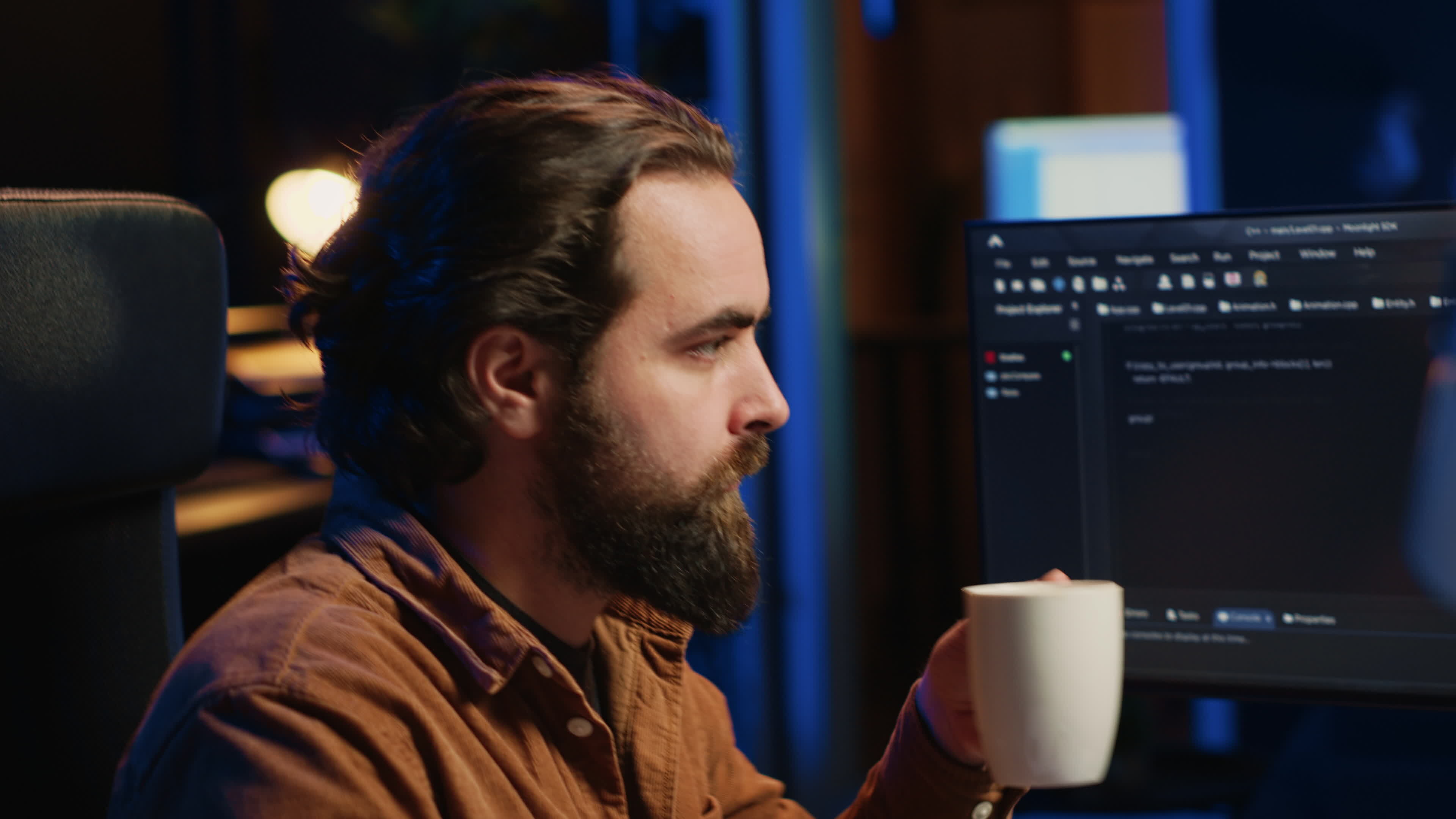 Computer Scientist Drinking Cup Of Coffee While Developing Code On Pc Using Java Programming