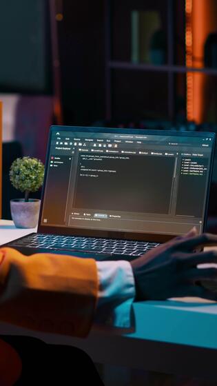 Vertical Video African american it specialist working with coding ...