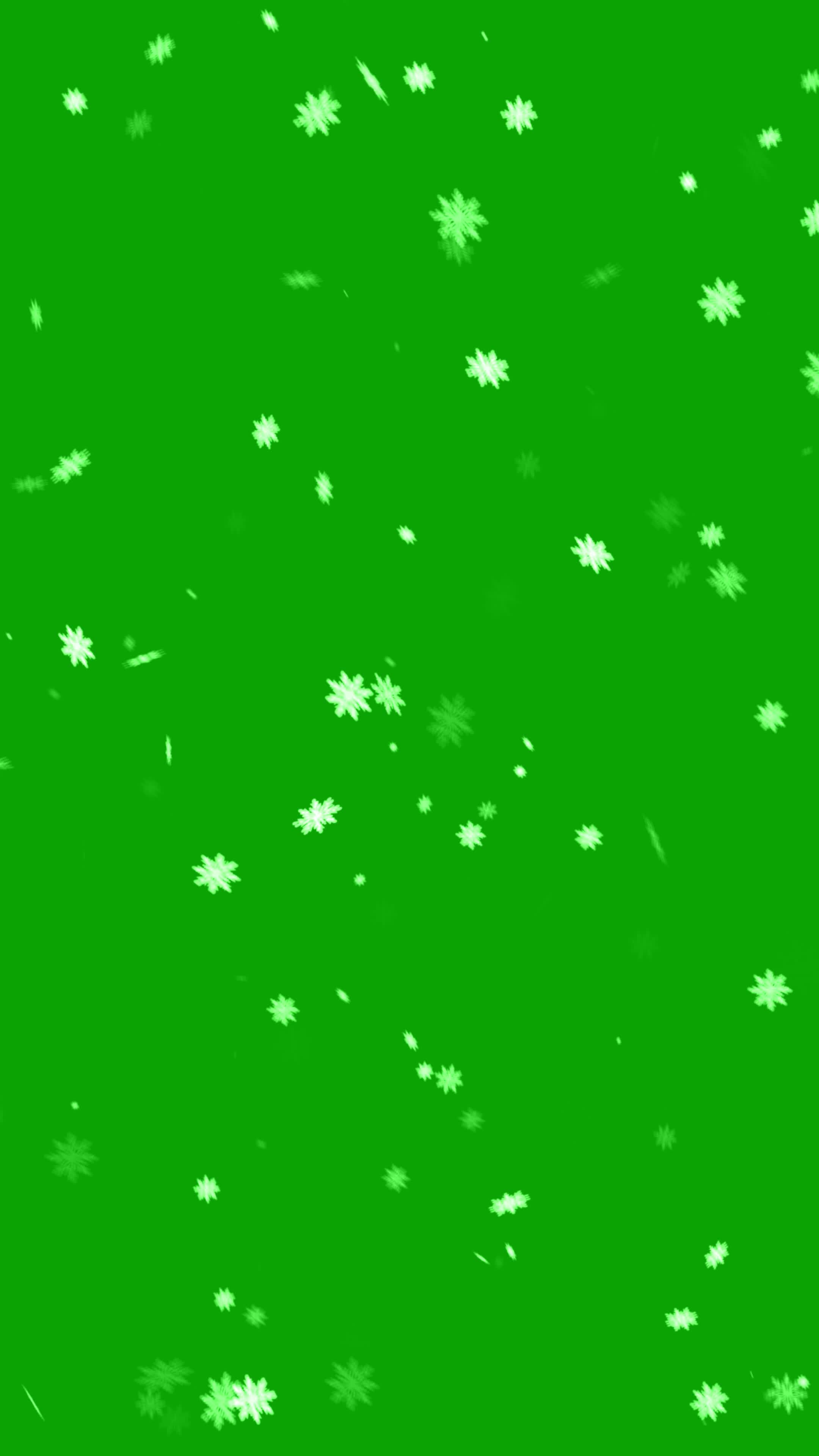 Snowfall overlay on green background. Winter slowly falling snow effect. 4K vertical animation ...