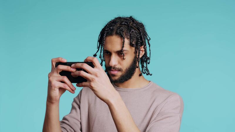 Gamer Disappointed After Receiving Game Over Screen On Cellphone Touchscreen Display Middle