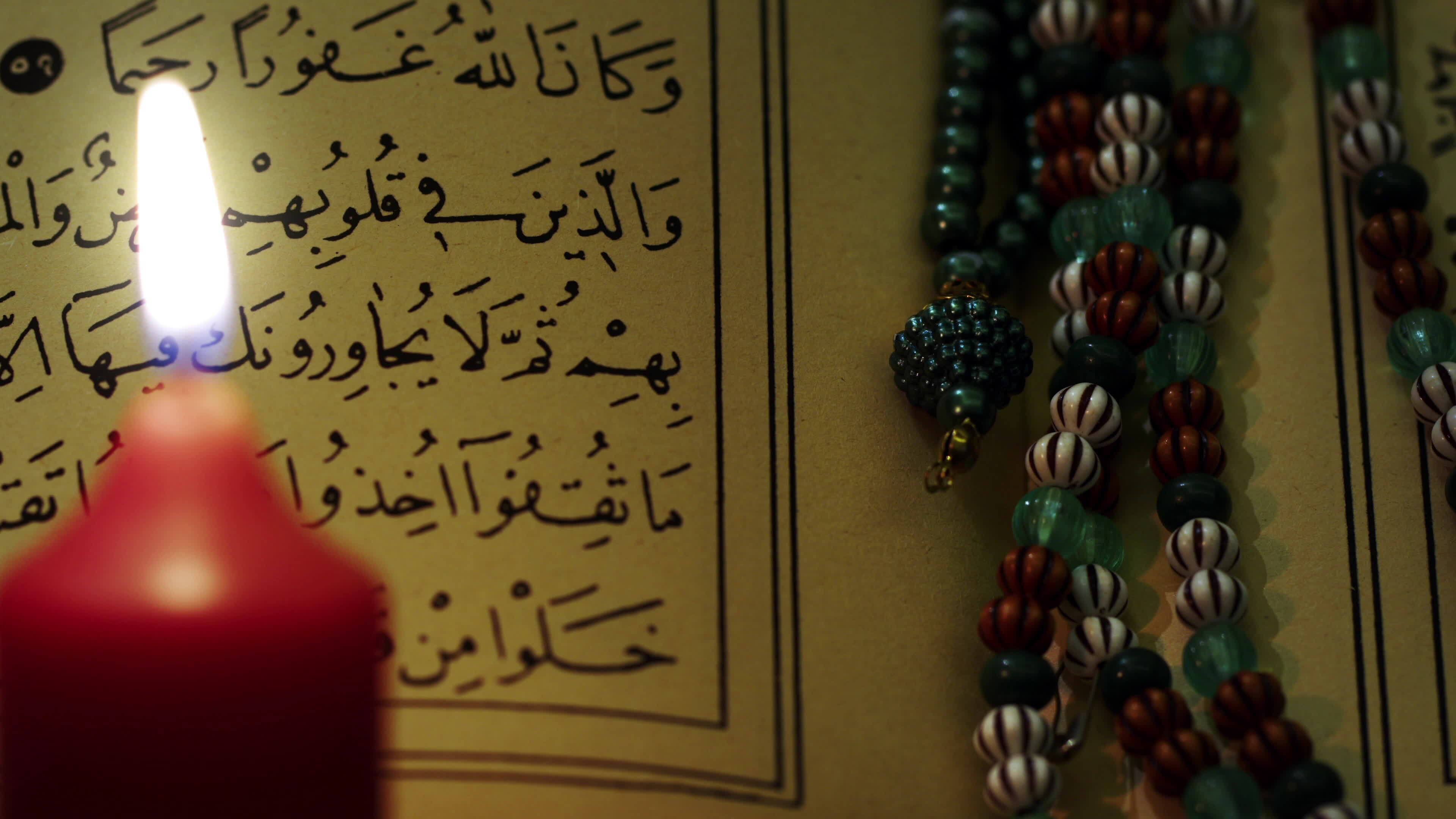 Religion The Book of Islam Quran in Candle Light 41056848 Stock Video at Vecteezy