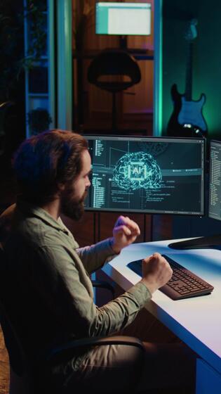 Vertical video Programmer being asked existential questions by awaken AI gaining consciousness ...