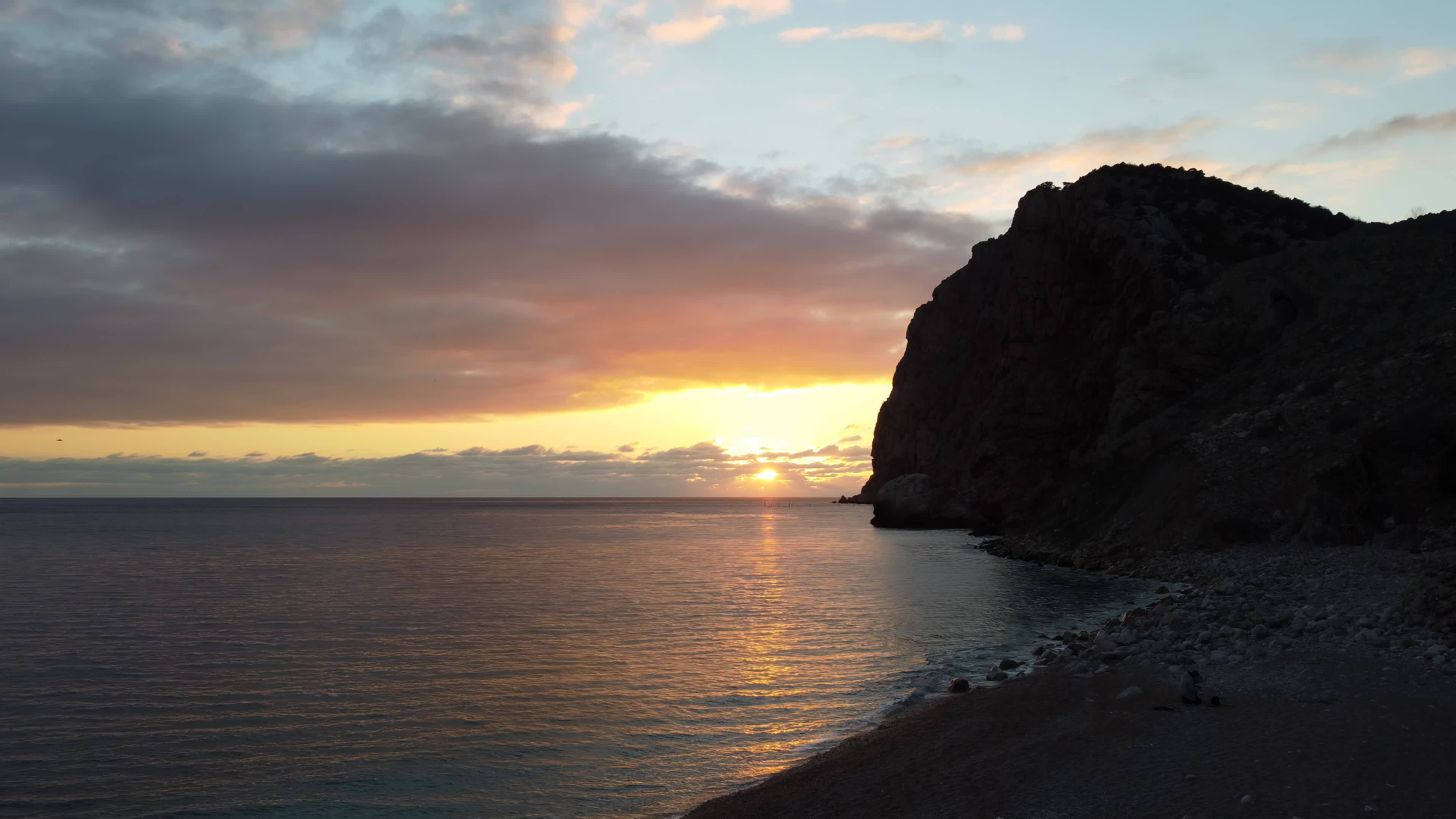 Aerial panoramic view of beautiful sunset above calm azure sea and ...