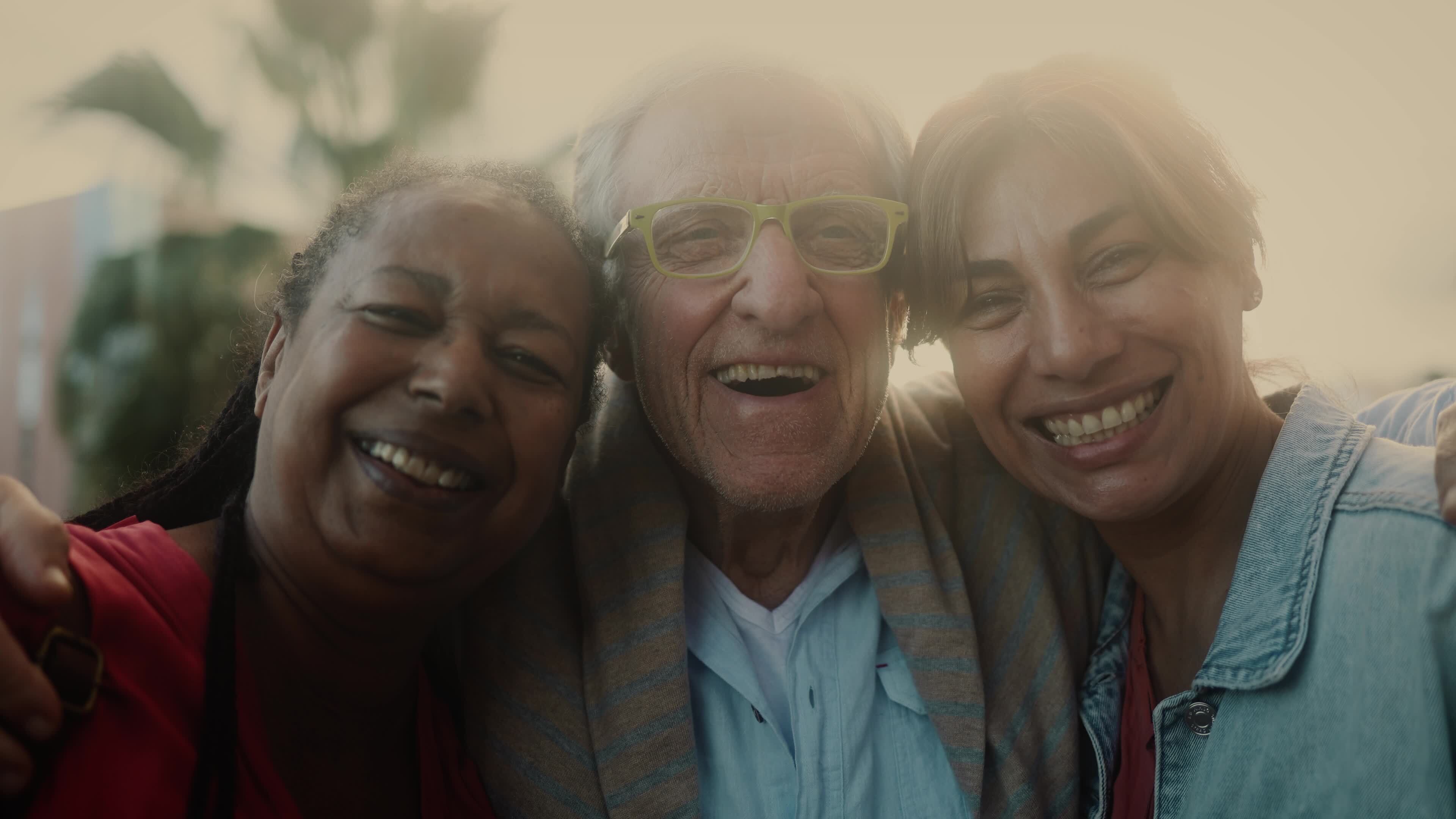an older man and two women smiling for the camera 41478496 Stock Video at Vecteezy
