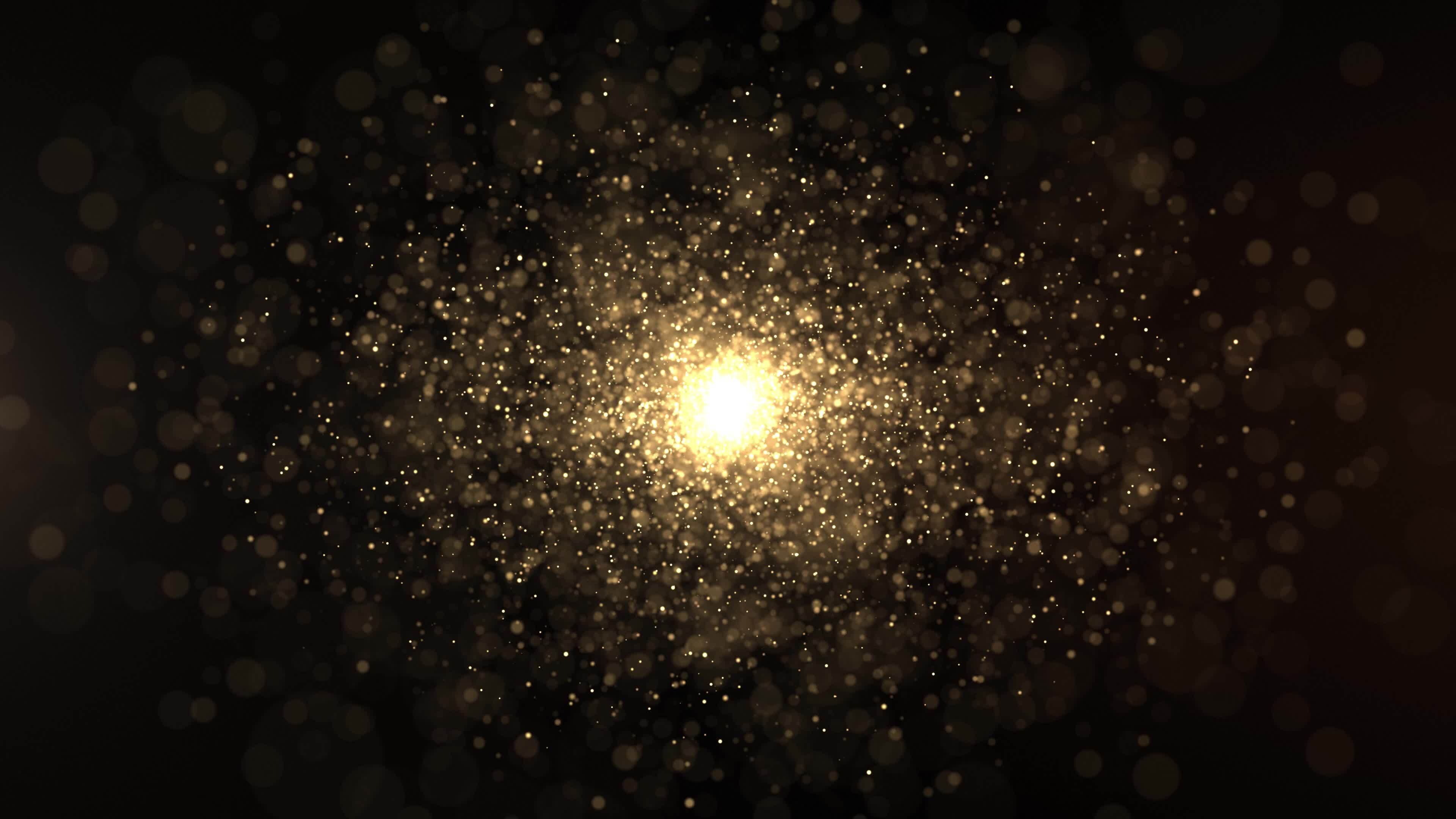 Abstract background of golden glitter particles. Beautiful bokeh and glowing dust. Luxurious ...