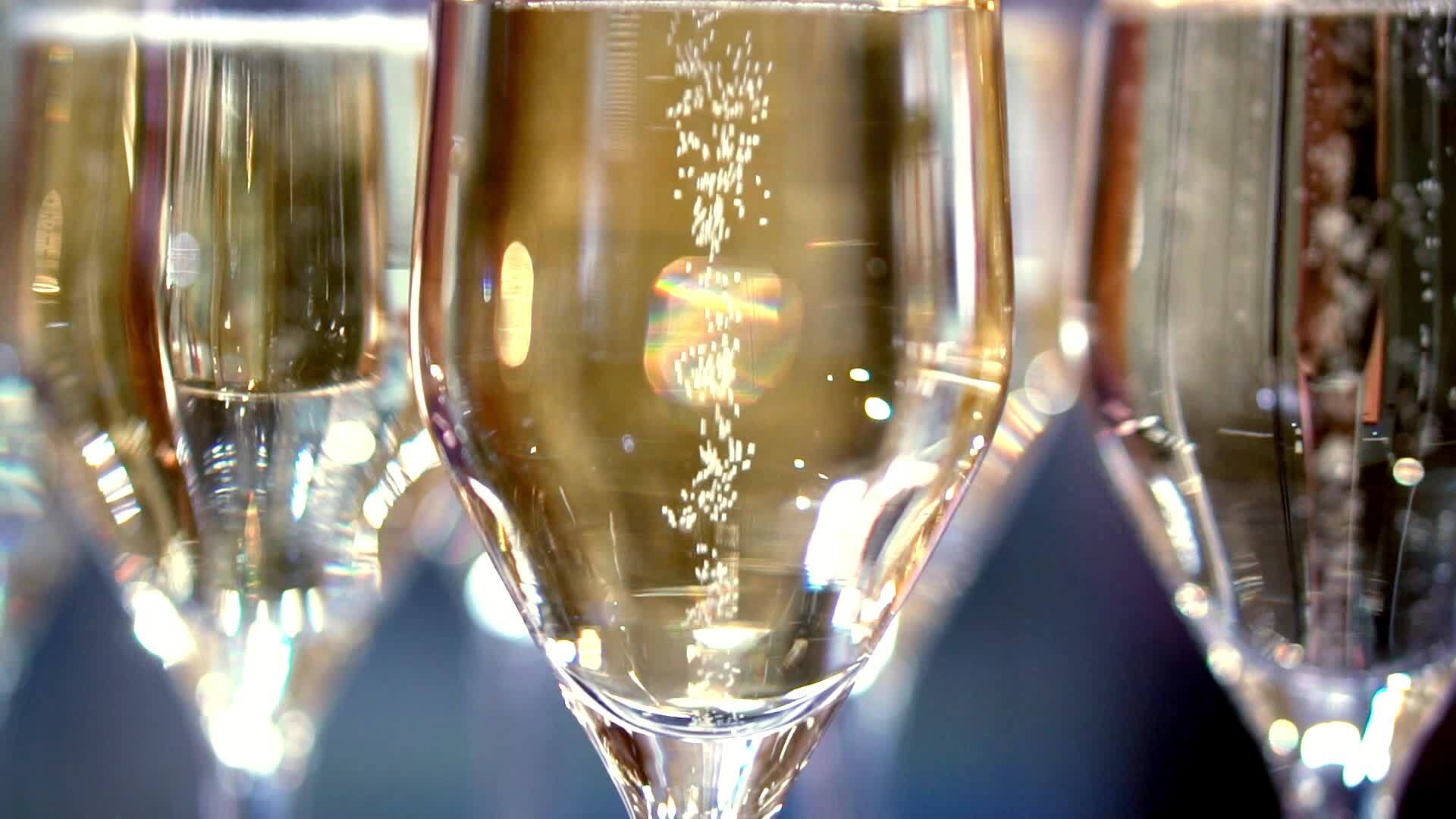 champagne in wine glasses. a sparkling wine. bubbles rise 41753869 Stock Video at Vecteezy